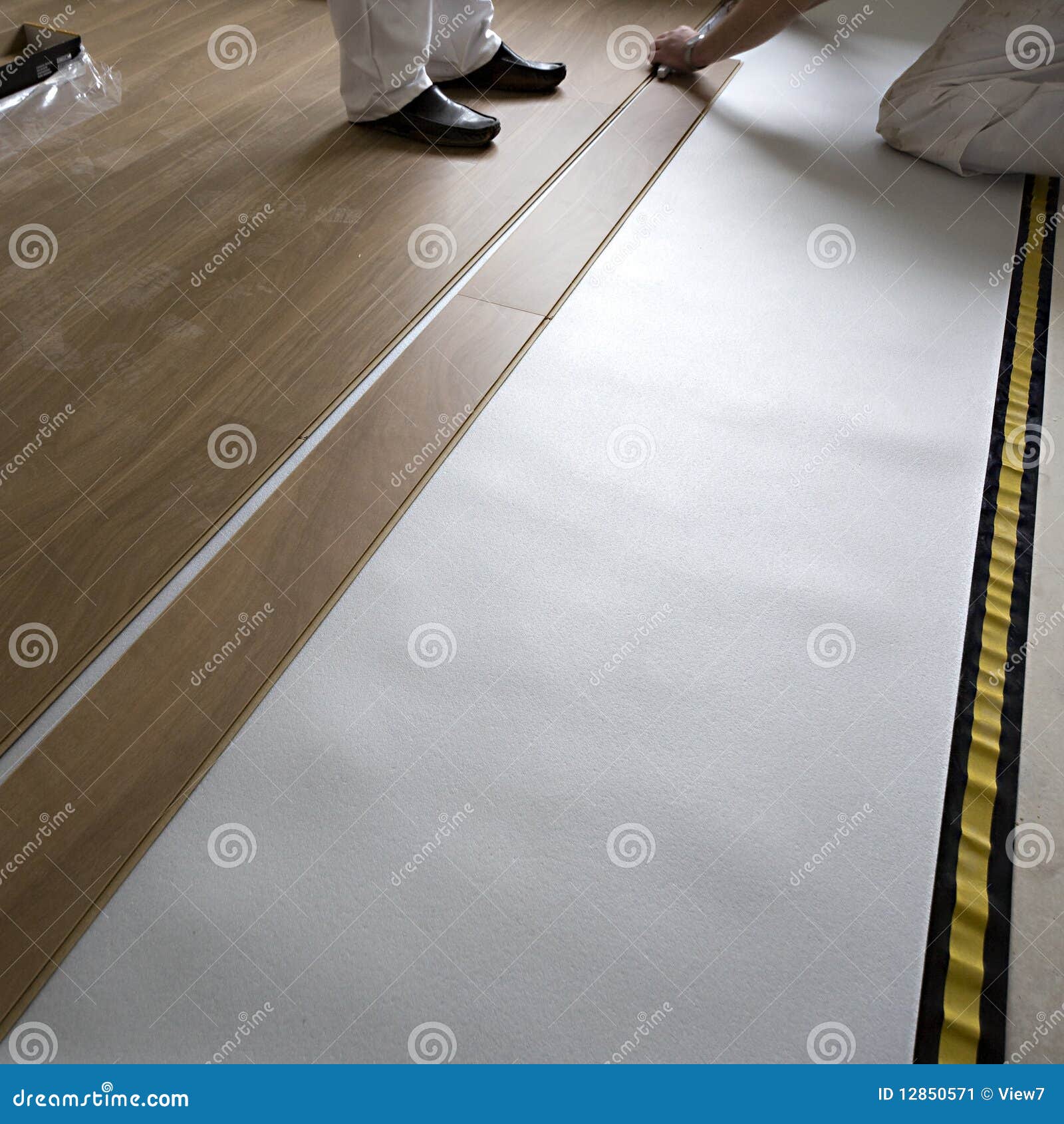 People laying wooden floor stock image. Image of flooring - 12850571