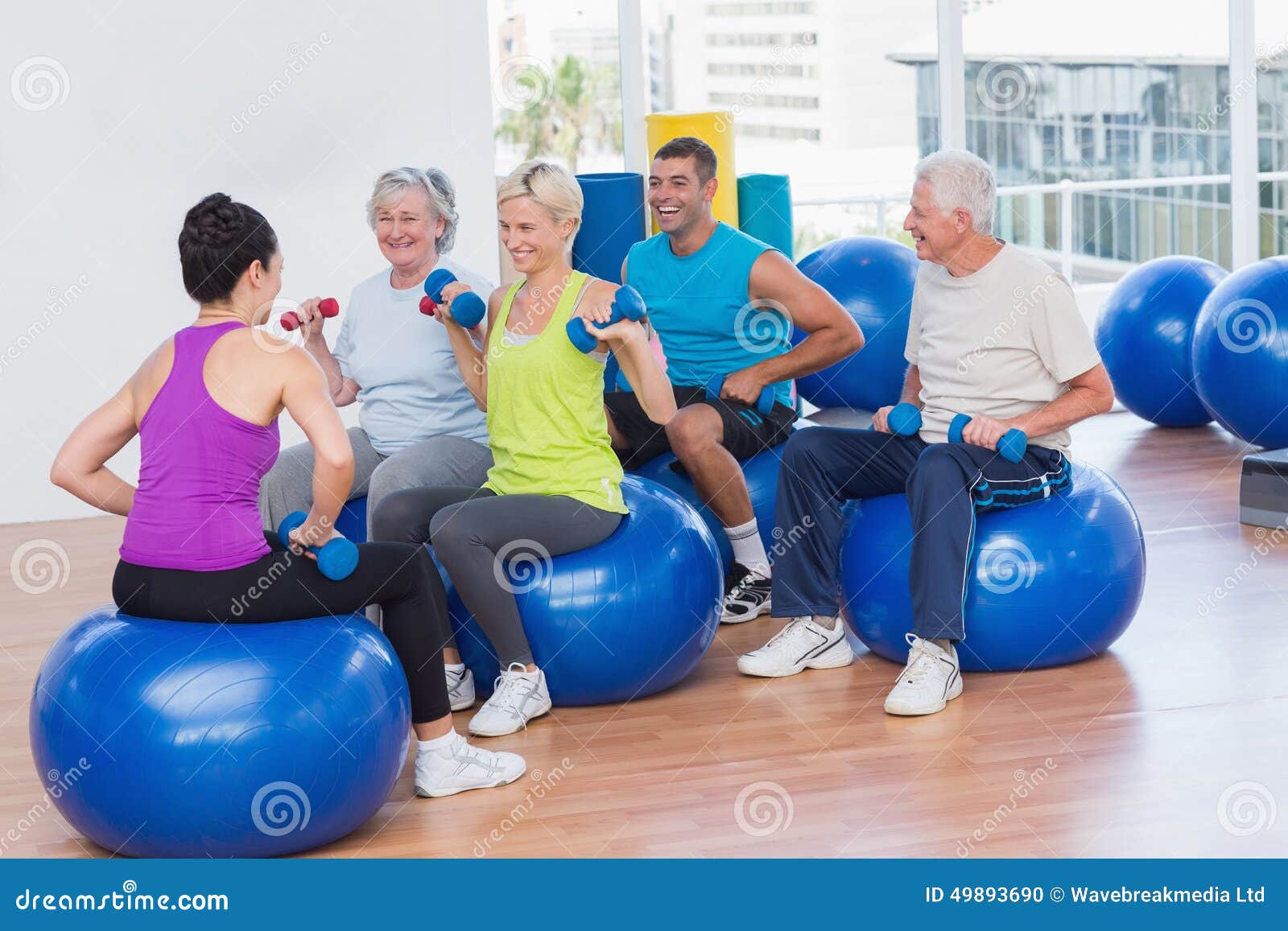 People Lifting Dumbbells in Gym Class Stock Photo - Image of flooring ...