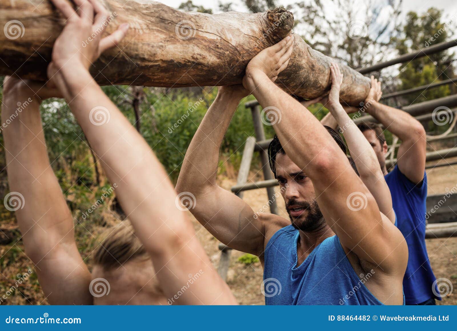 People Lifting a Heavy Wooden Log during Boot Camp Stock Photo - Image ...