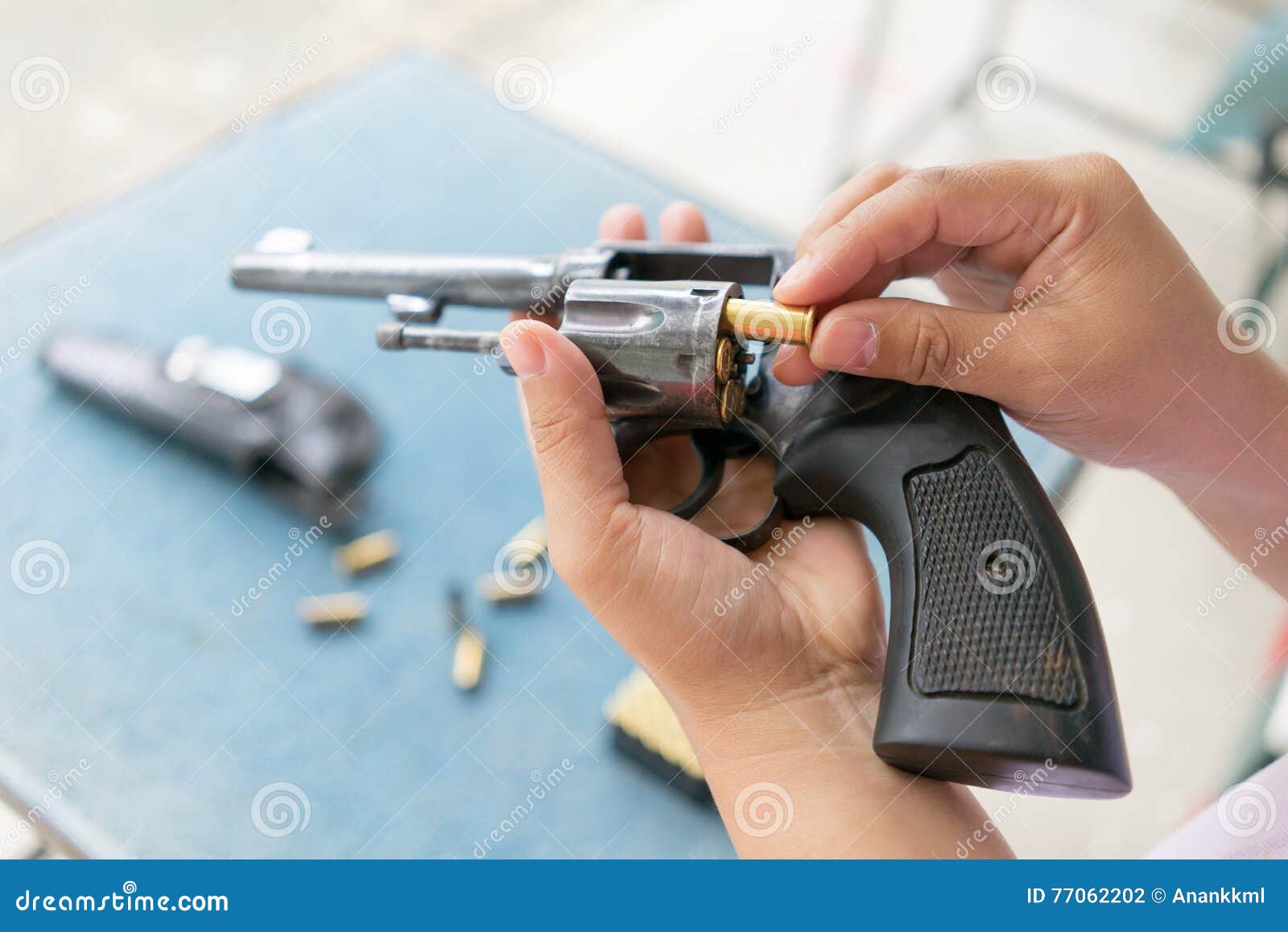 People Load Bullets into Revolver Gun Stock Photo - Image of ammo ...