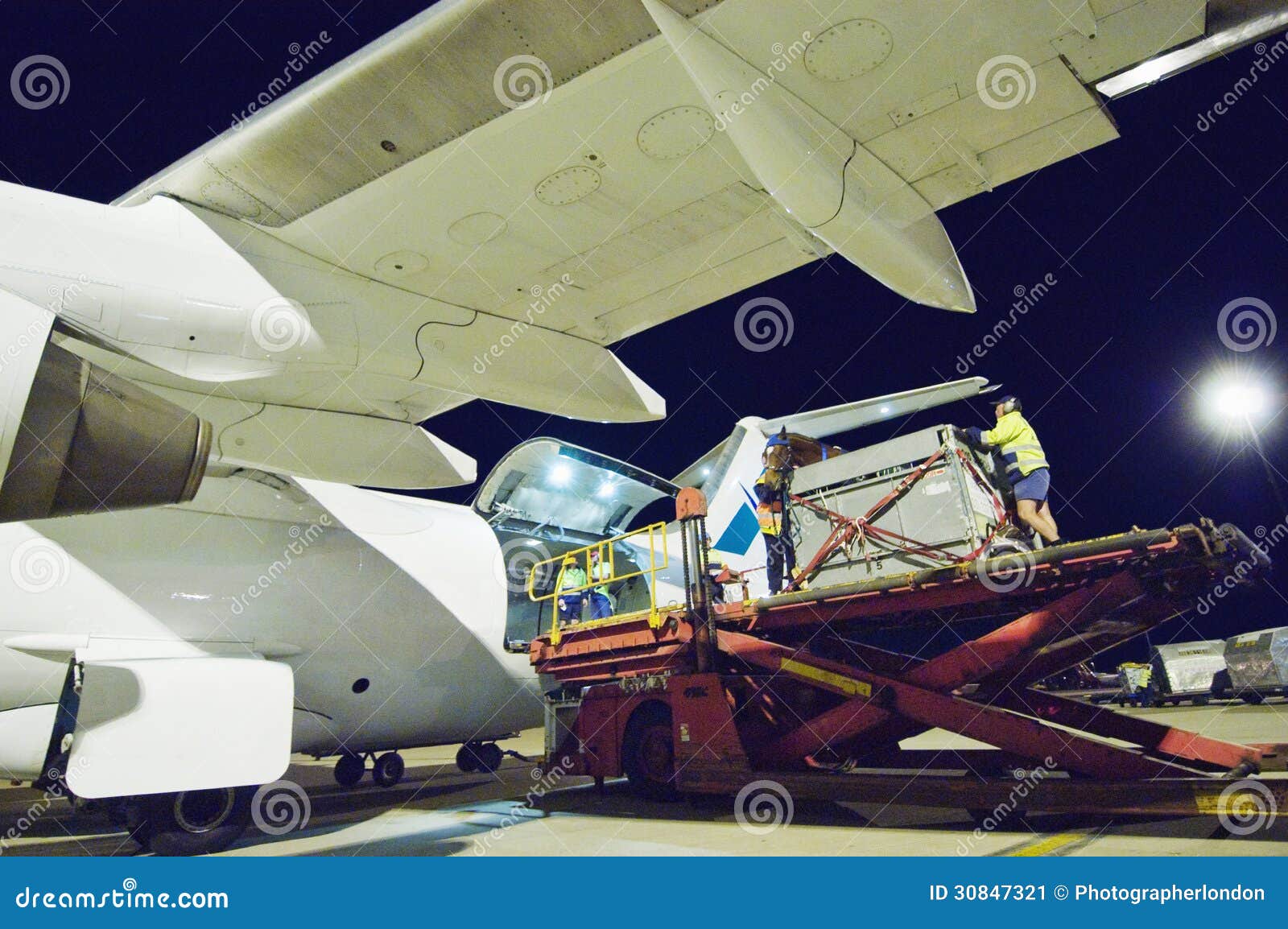 People Loading Aeroplane at Airport Stock Image - Image of night, cargo ...