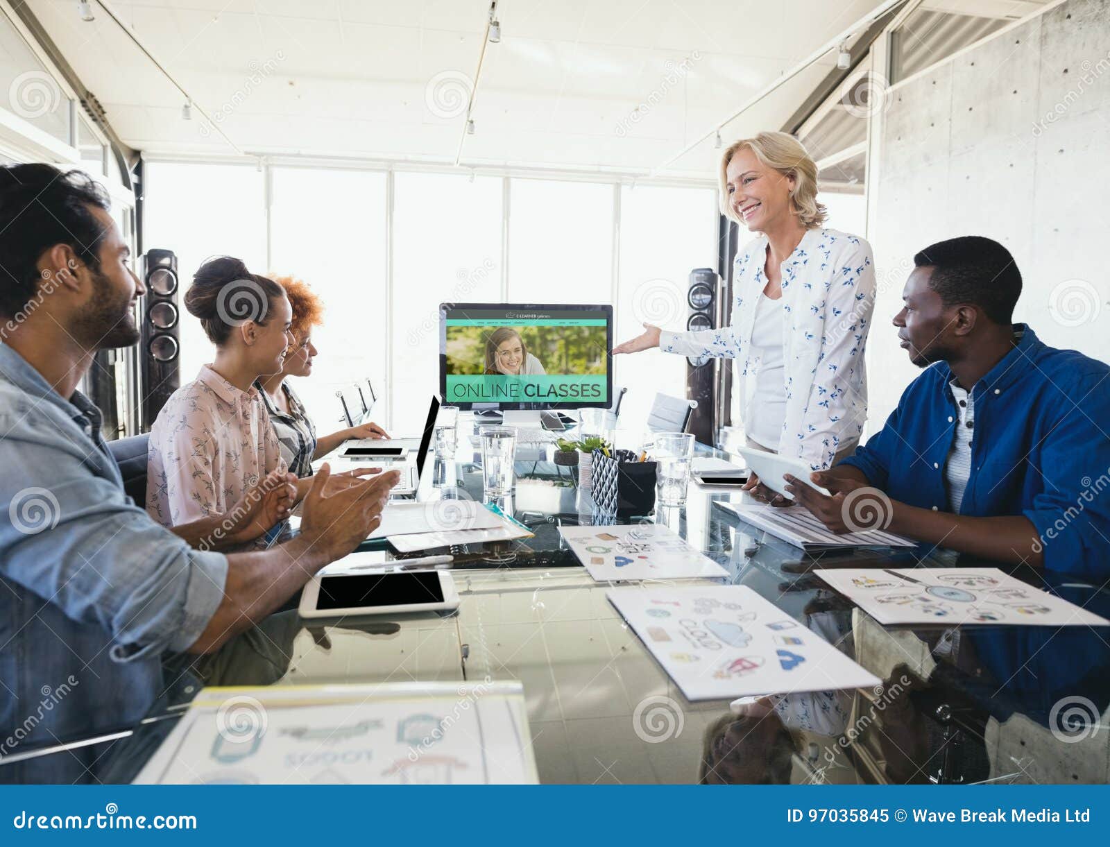 People Looking at a Computer with E-learning Information in the Screen ...