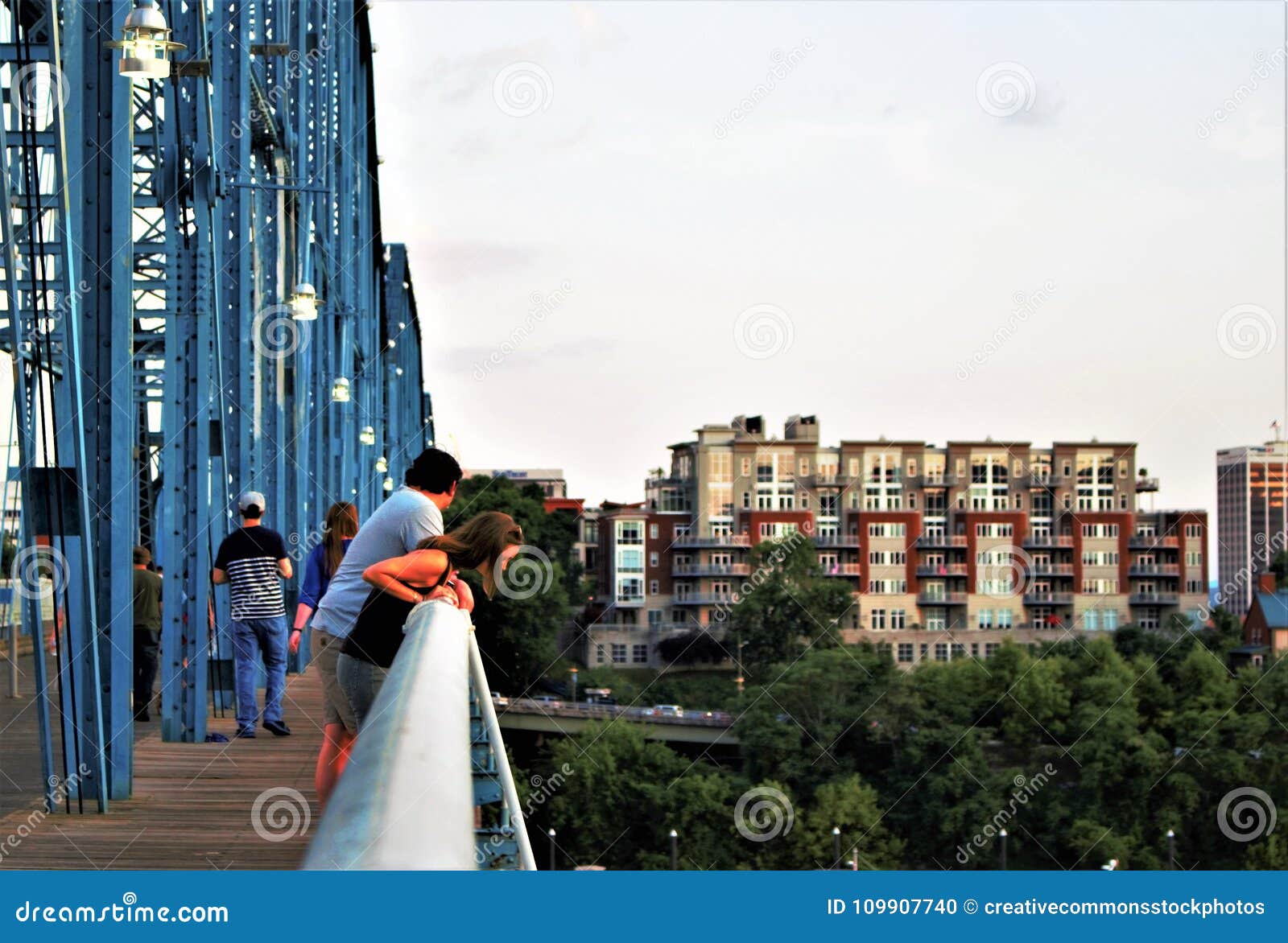 People Looking Down A Bridge Picture. Image: 109907740