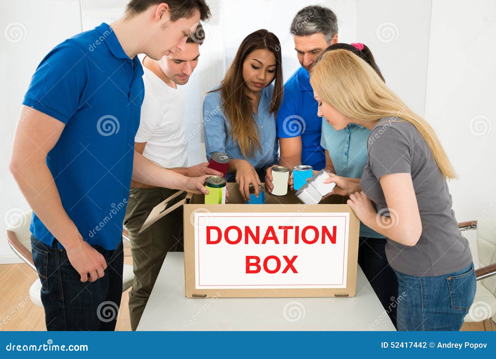 People Looking Inside Donation Box Stock Photo - Image of holding ...