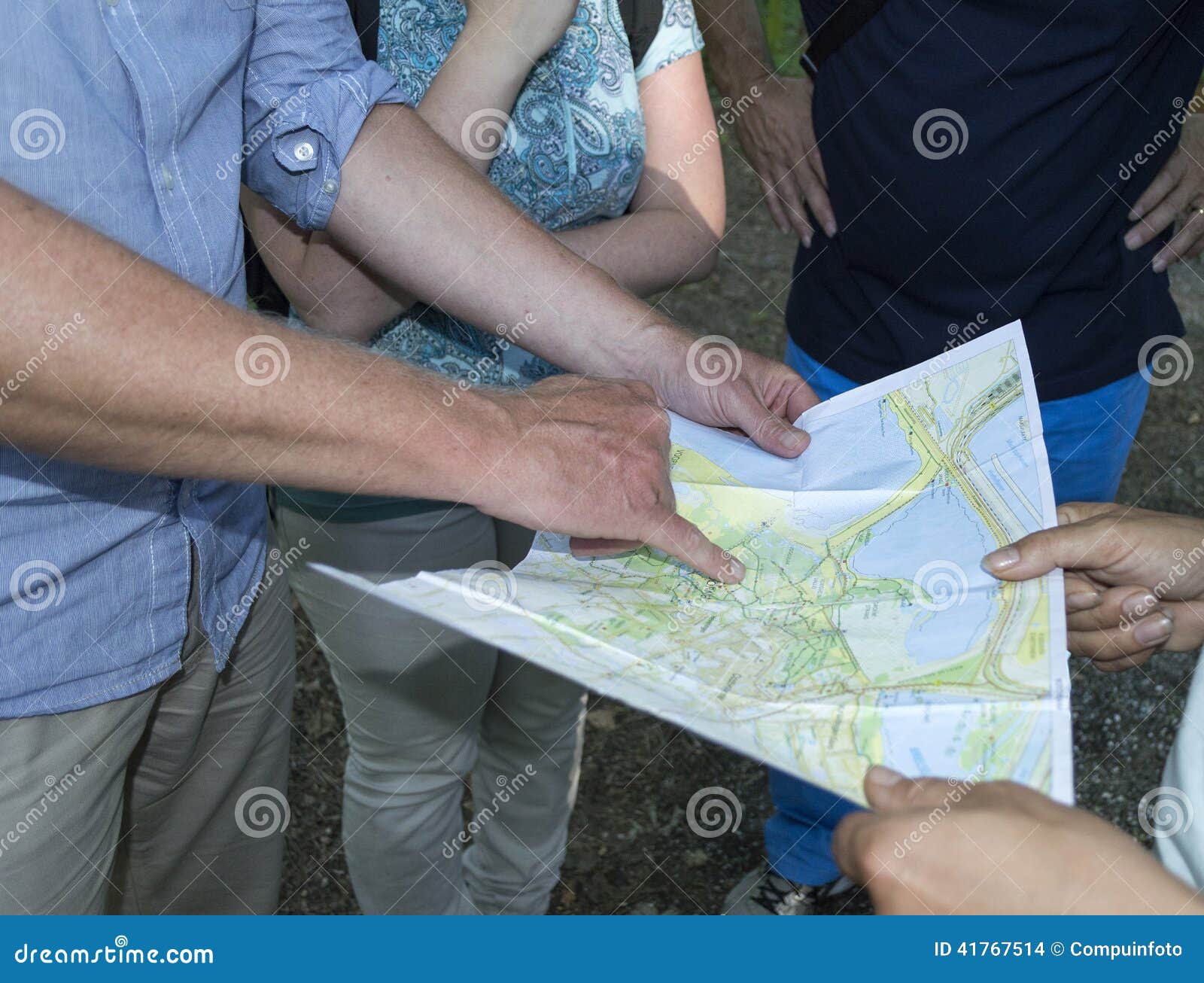 People looking at the map stock photo. Image of reading - 41767514