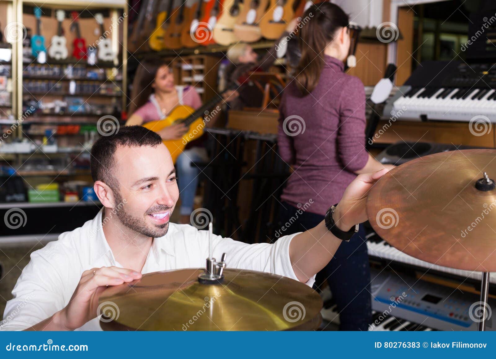 People Looking at Musical Instruments Stock Image - Image of saleswoman ...