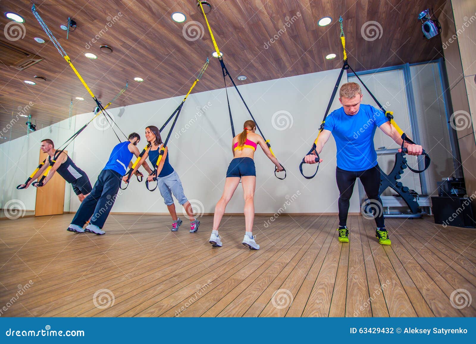 People Make Fitnes Exercise with a Band in the Gym Stock Photo - Image ...
