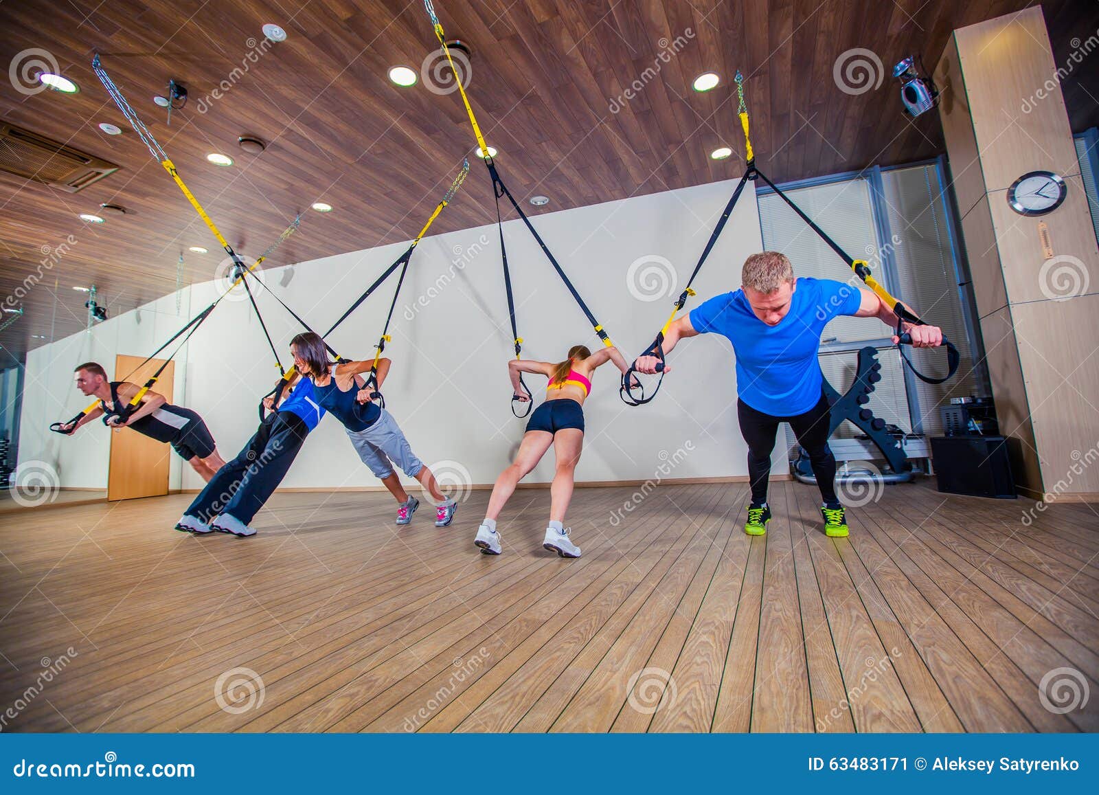 People Make Fitnes Exercise with a Band in the Gym Stock Image - Image ...