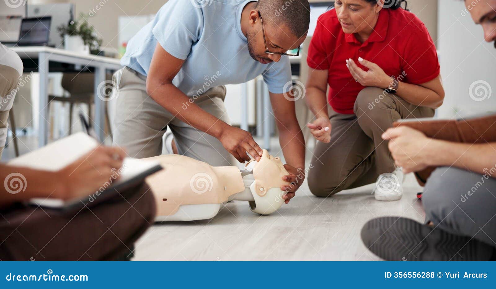 People, Mannequin and Training in Office for First Aid, CPR Workshop or ...