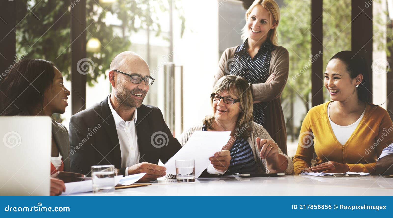 Business People in a Meeting at a Table Stock Photo - Image of ...