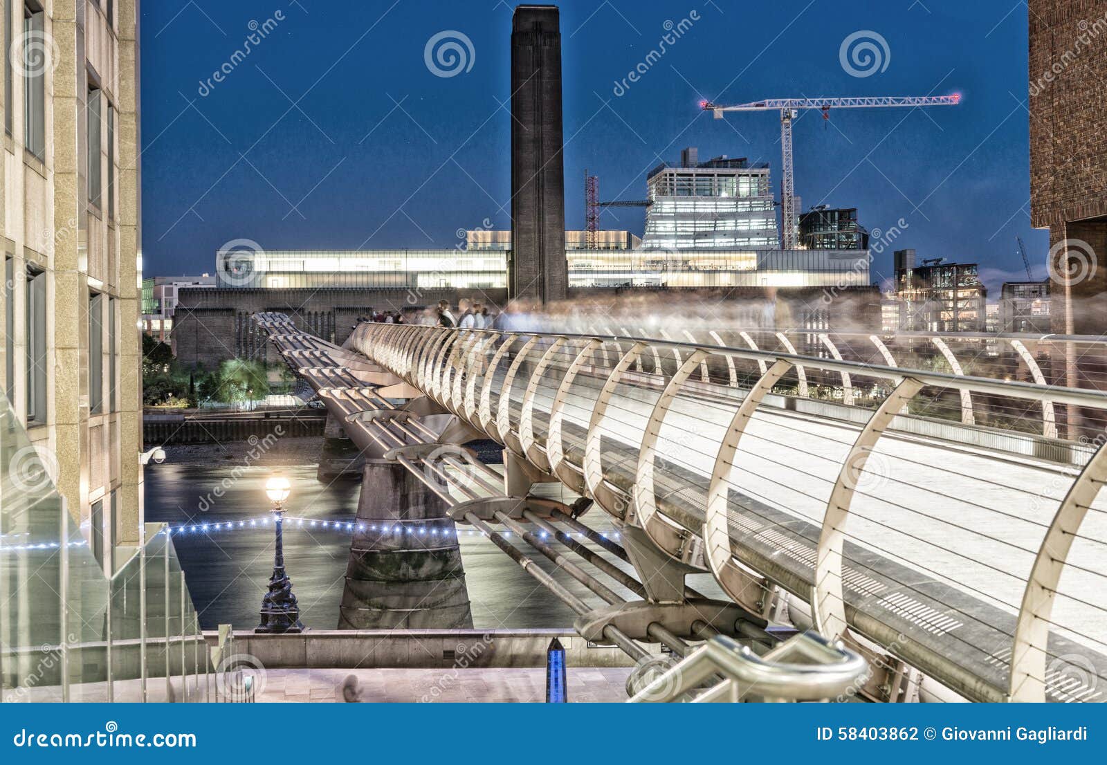 People Moving on Millennium Bridge at Night - London Editorial ...