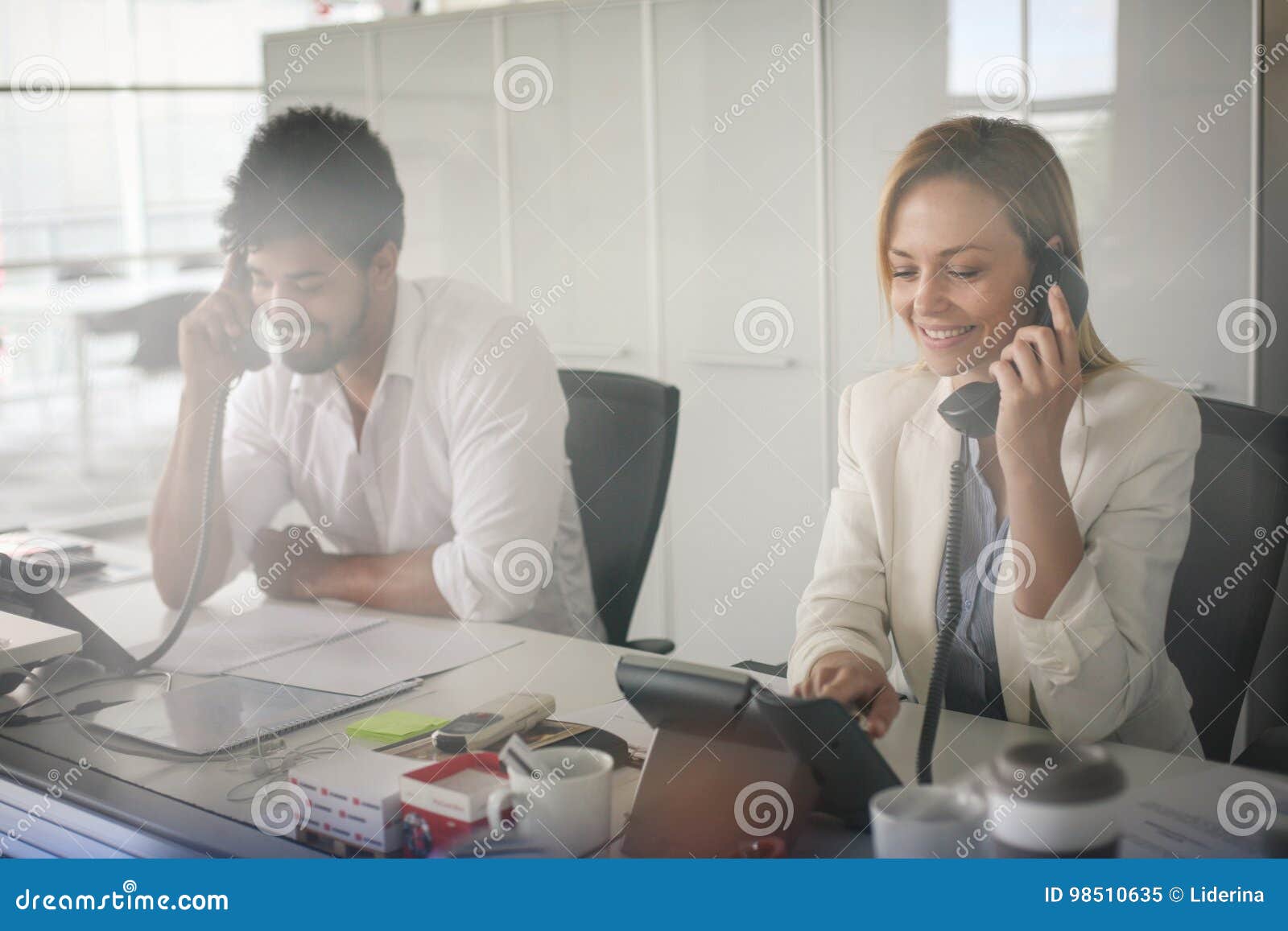 People in Operations Center Talking on Landline Phone. Stock Image ...