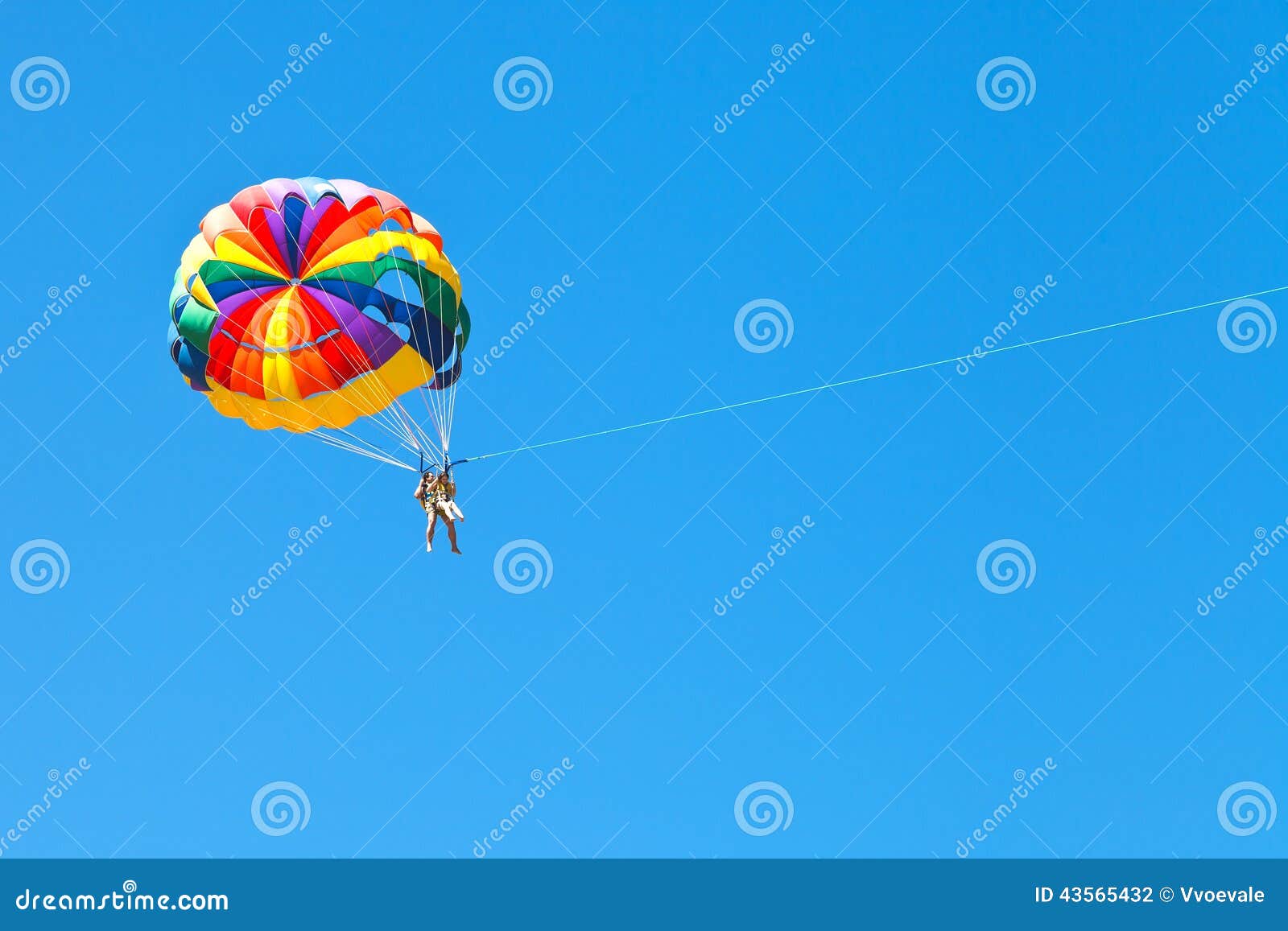 People Parascending on Parachute in Blue Sky Stock Photo - Image of ...