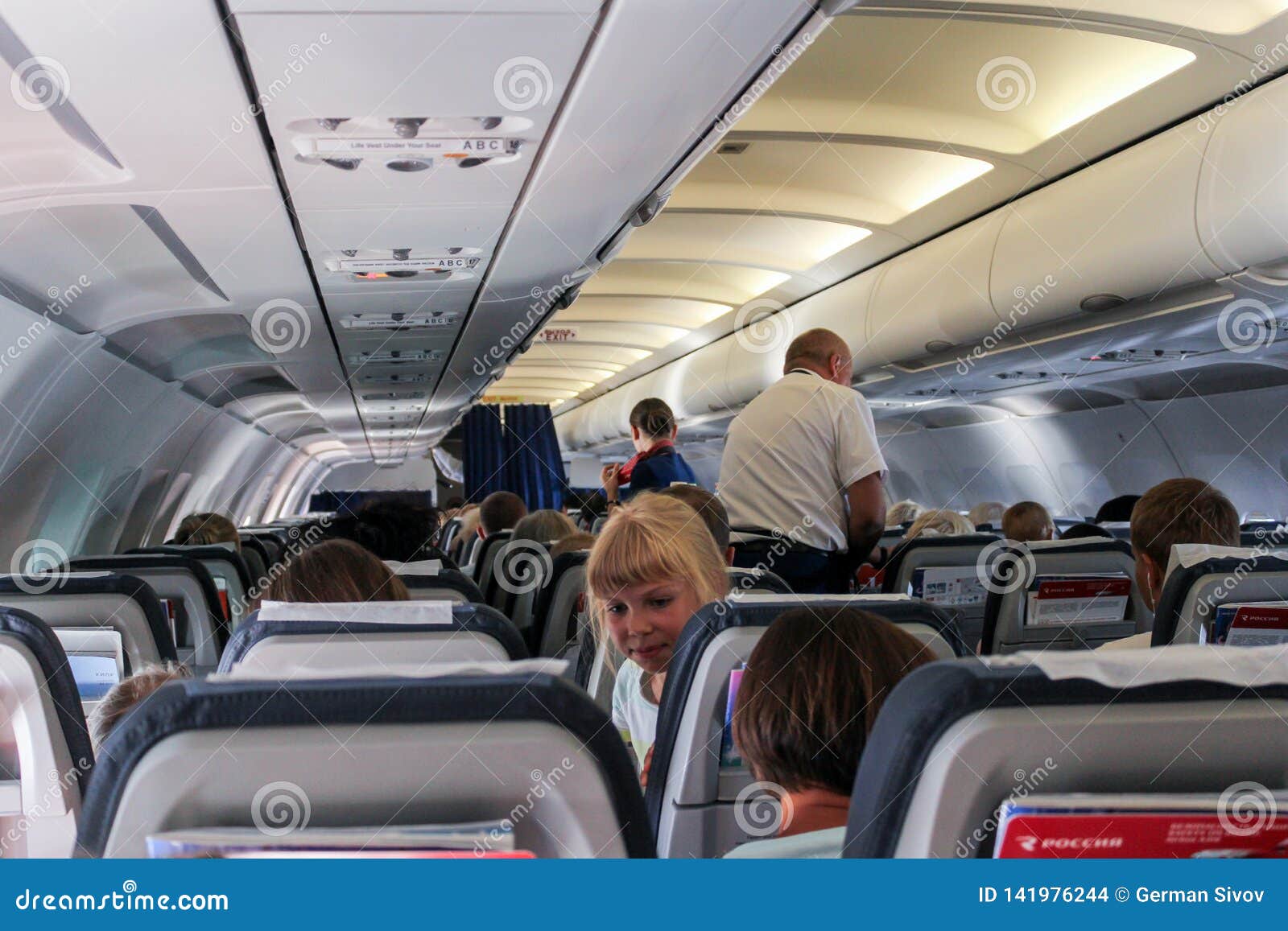 People on the plane editorial stock image. Image of plane - 141976244