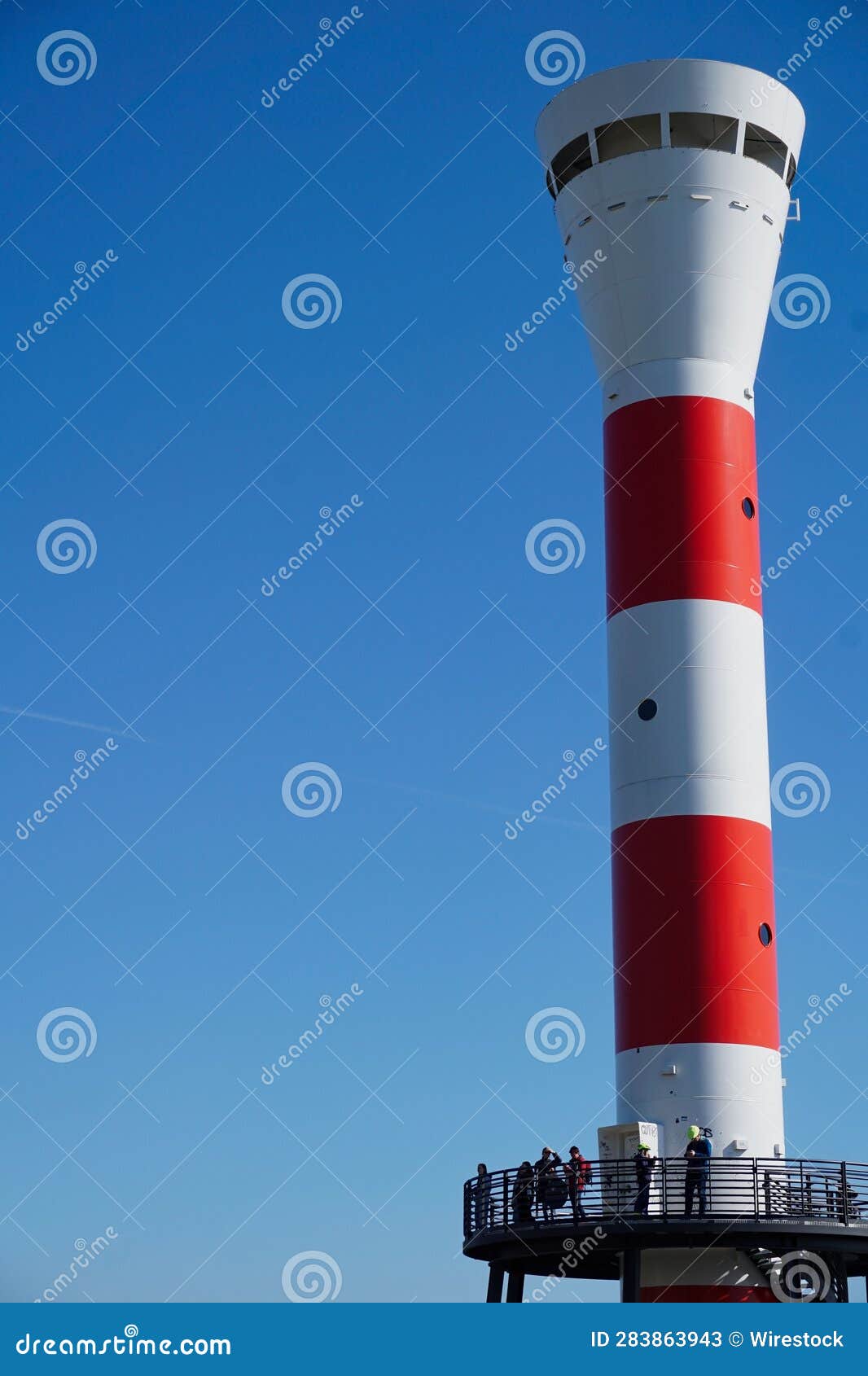 People on the Platform of a Red-white Lighthouse in Front of Blue Sky ...