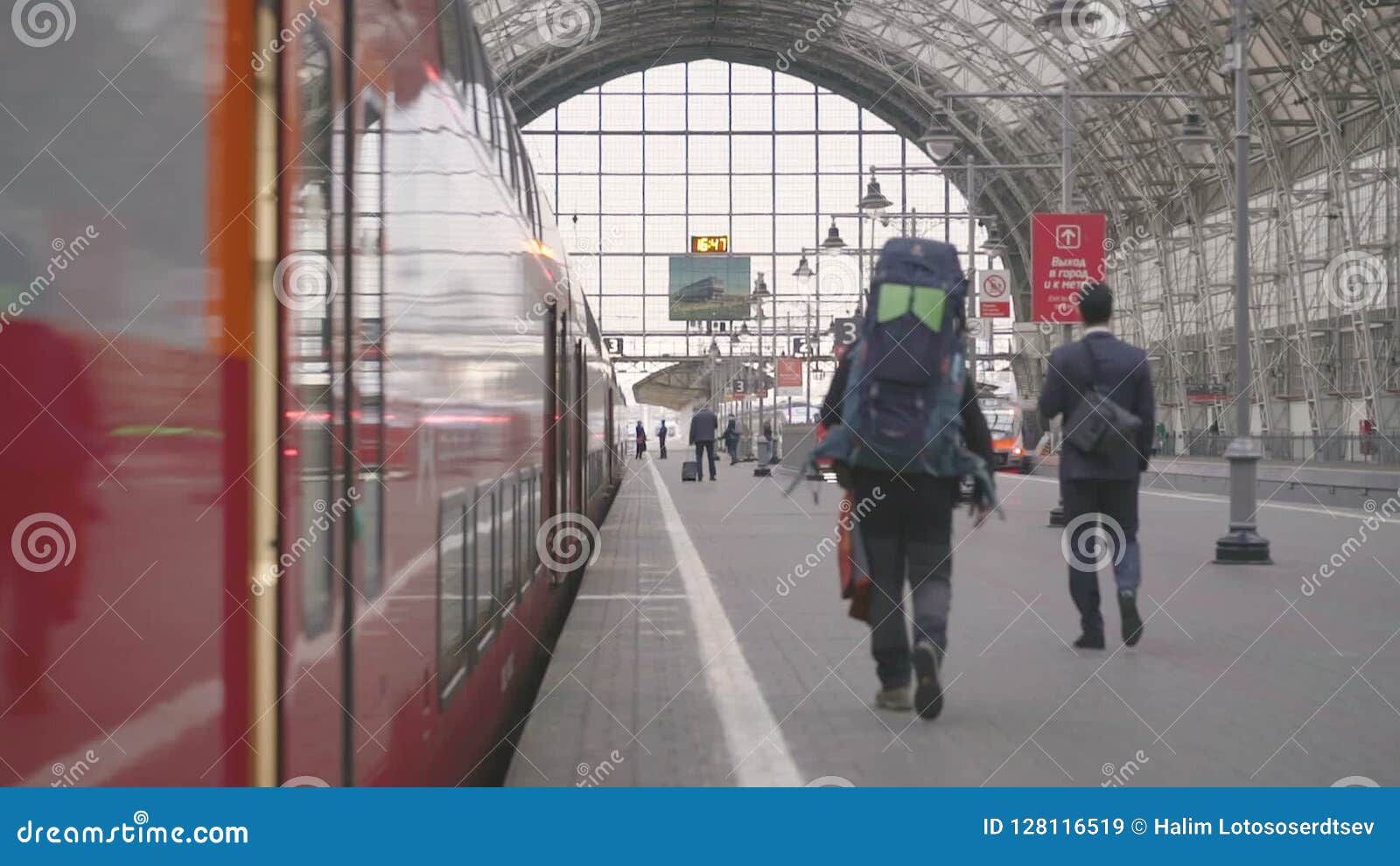 Passengers Walking on the Platform To Catch a Train in the Railway ...