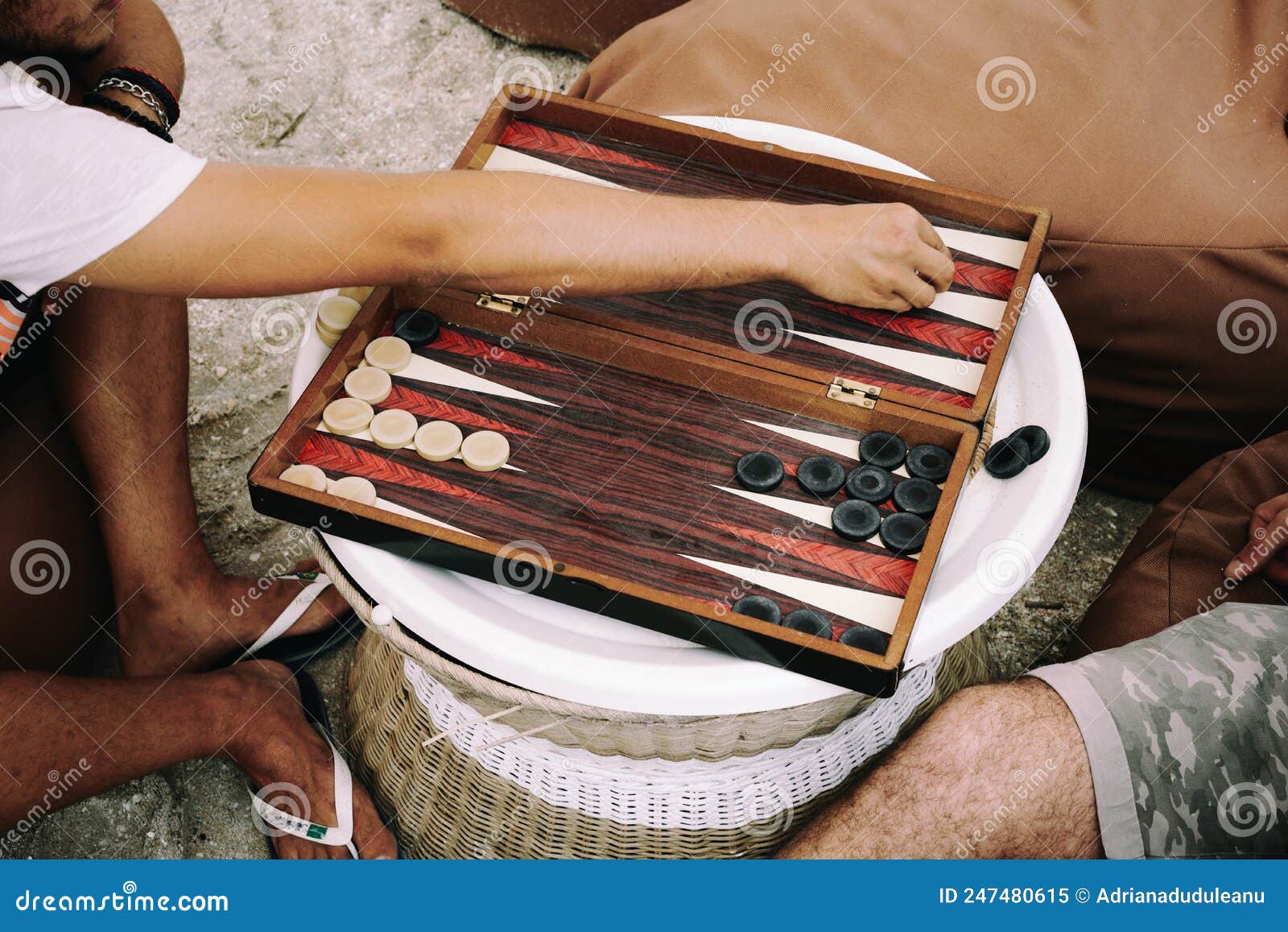 People playing backgammon stock image. Image of hand - 247480615