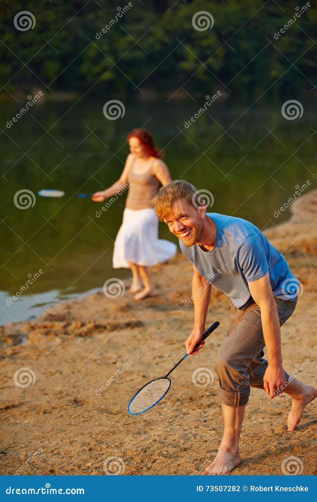 People Playing Badminton on Vacation Stock Photo - Image of competition ...