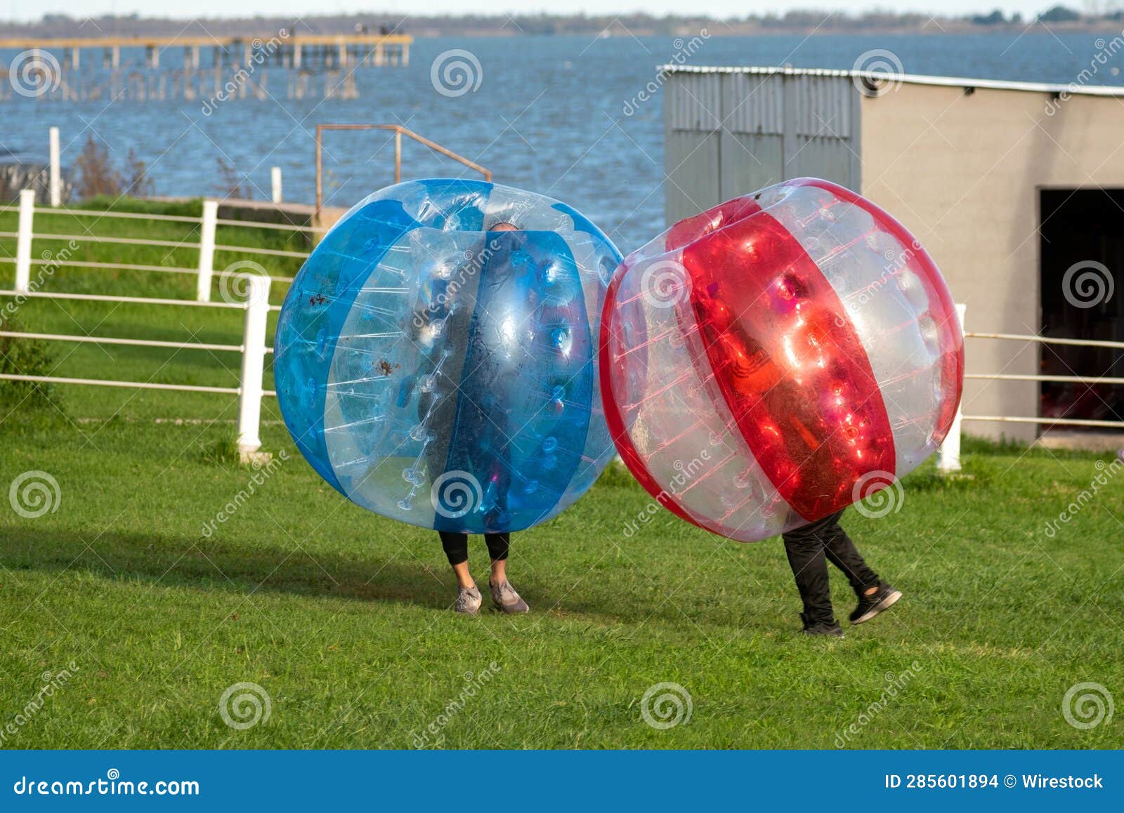 People Playing Bubble Soccer on a Green Field. Stock Photo - Image of ...