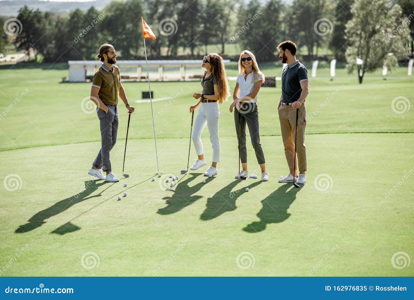 People Playing on a Golf Course Stock Image - Image of golfclub, adult ...