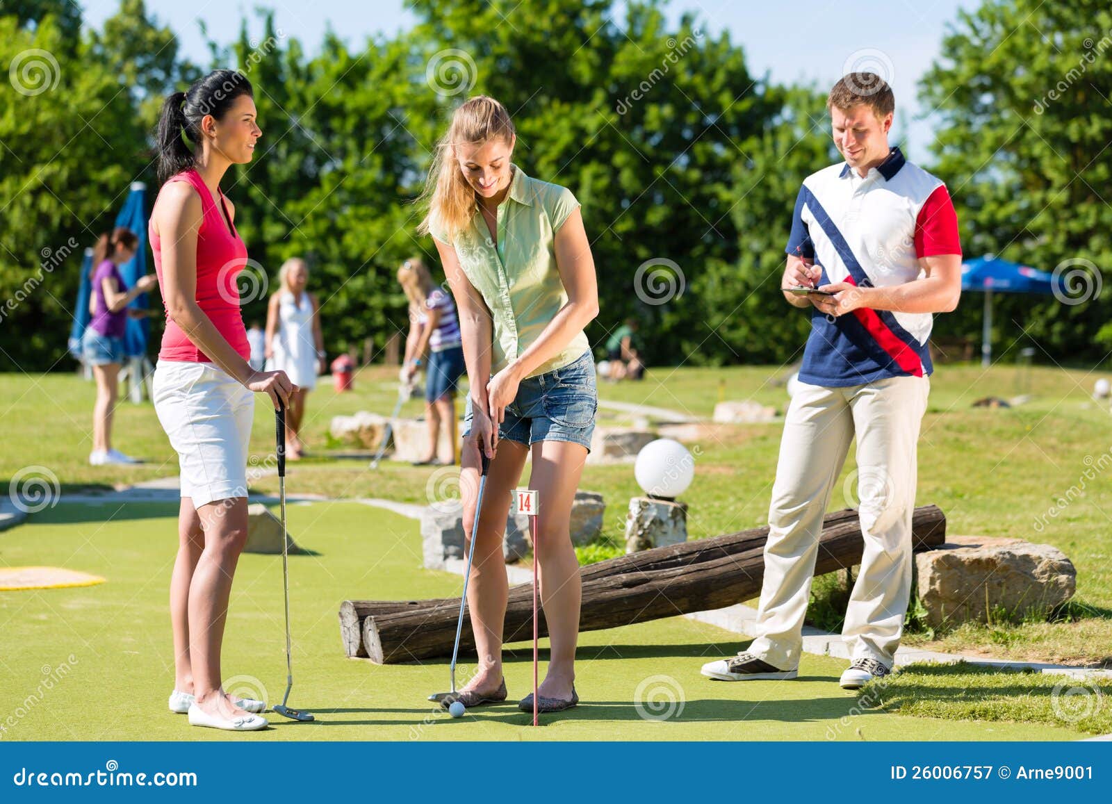People Playing Miniature Golf Outdoors Stock Image - Image of club ...