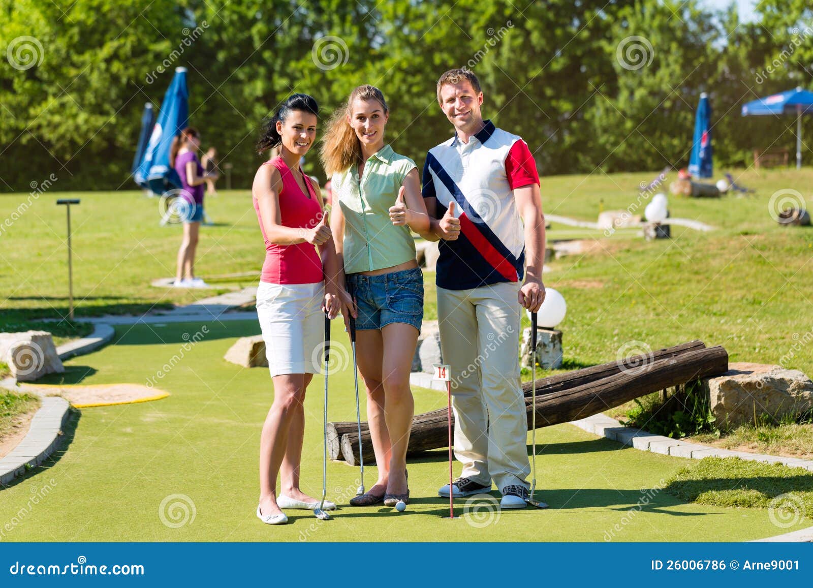 People Playing Miniature Golf Outdoors Stock Photo - Image of women ...