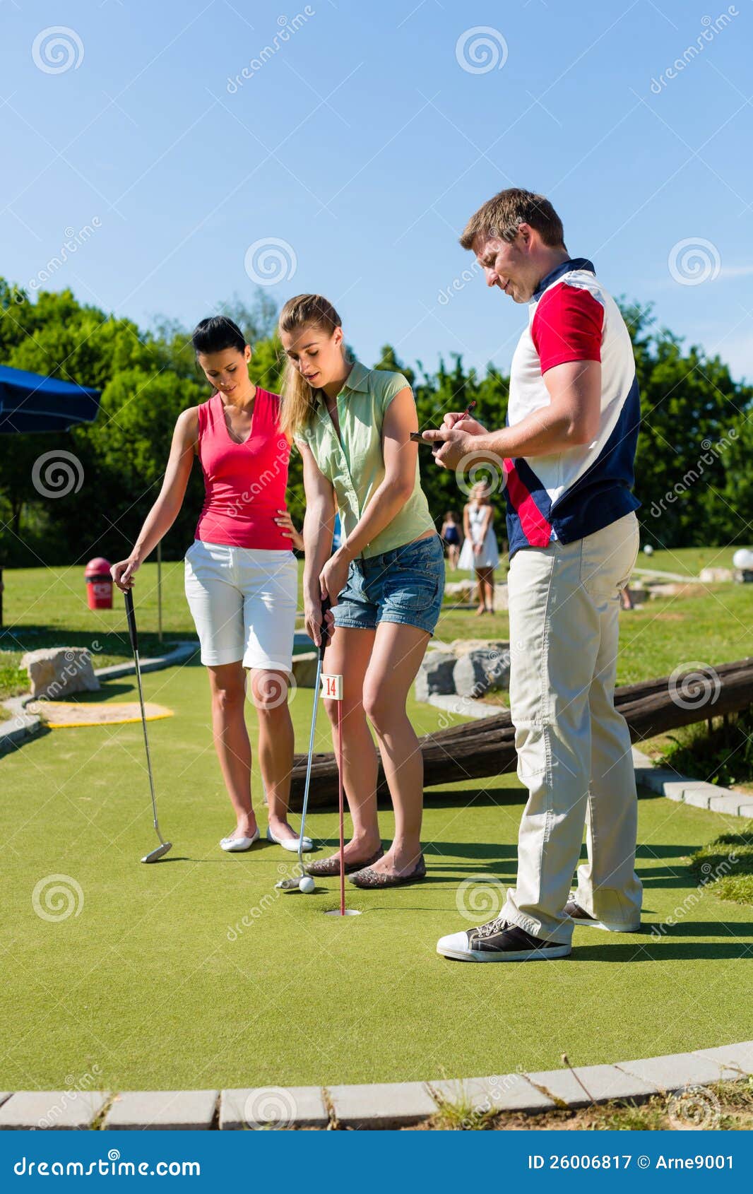 People Playing Miniature Golf Outdoors Stock Image - Image of putter ...