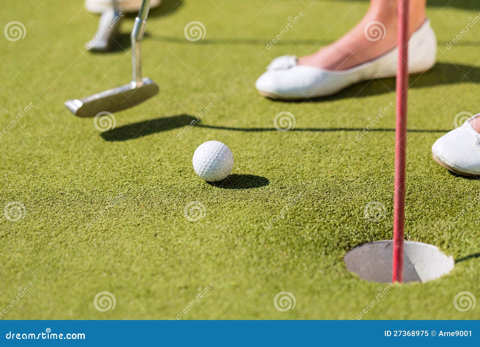 People Playing Miniature Golf Outdoors Stock Image - Image of young ...