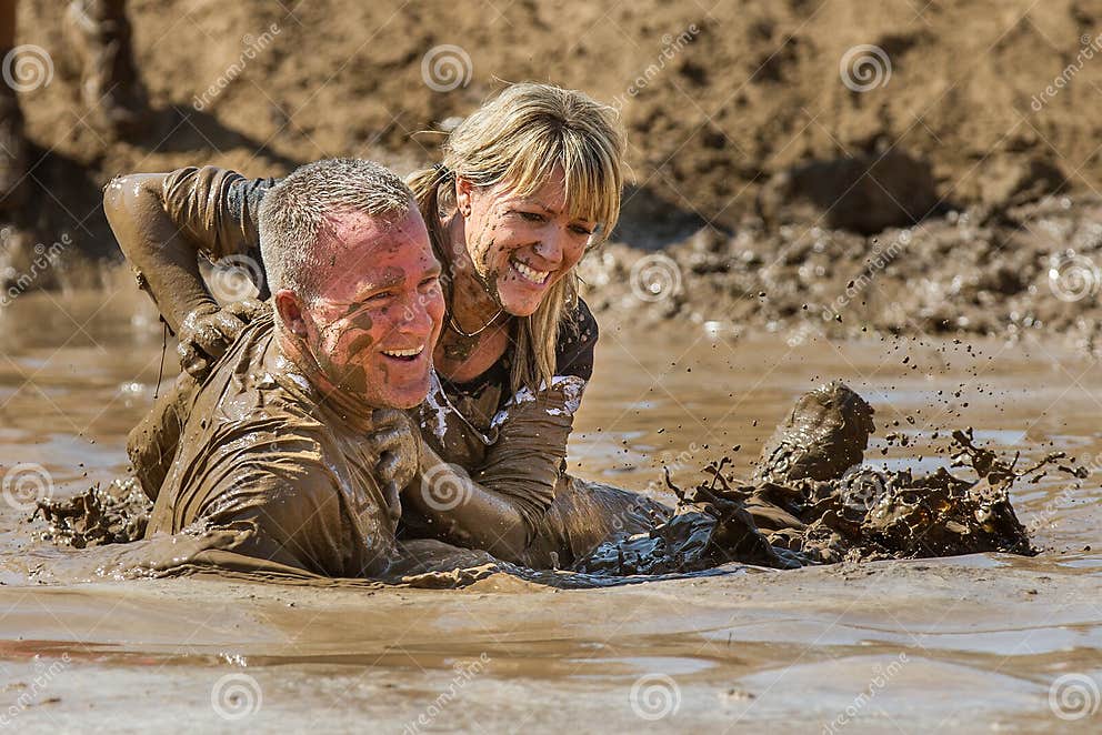 People Playing in the Mud Together Editorial Photography - Image of ...