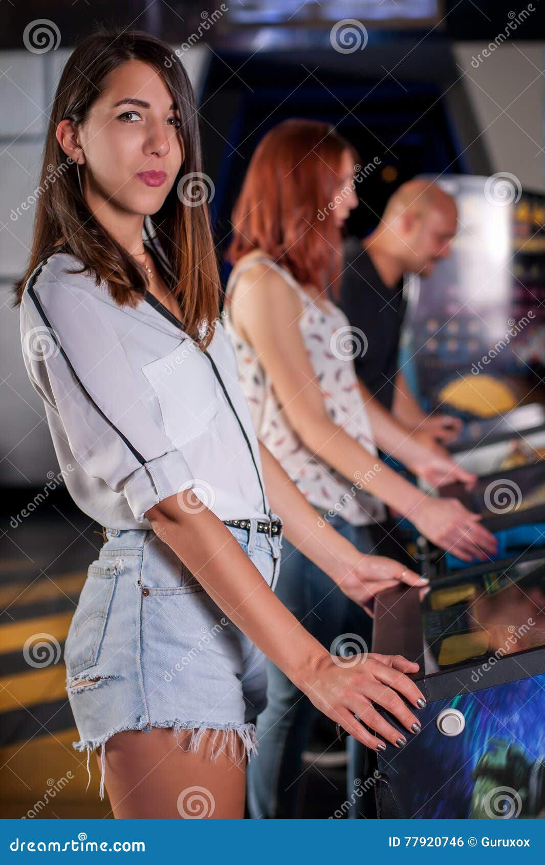 People Playing Pinball at Arcade Stock Photo - Image of electronic ...