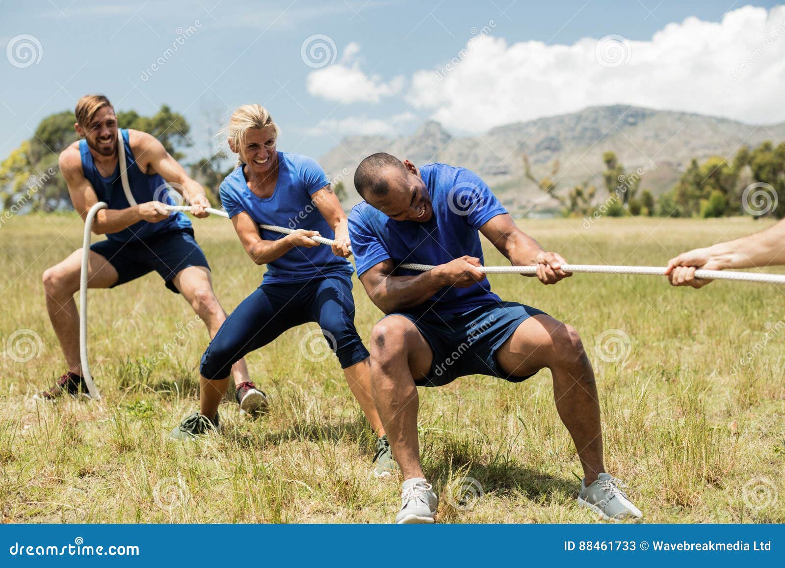 People Playing Tug of War during Obstacle Training Course Stock Image ...
