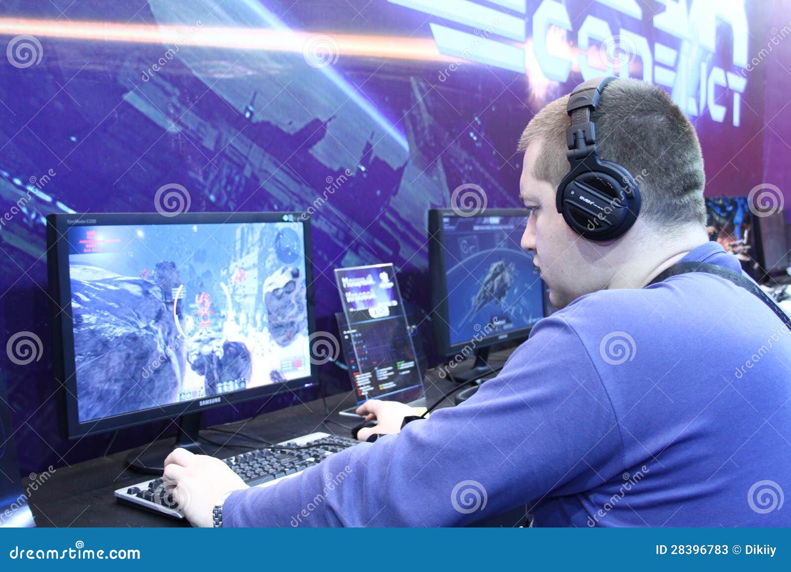 People playing video games editorial stock photo. Image of monitor ...