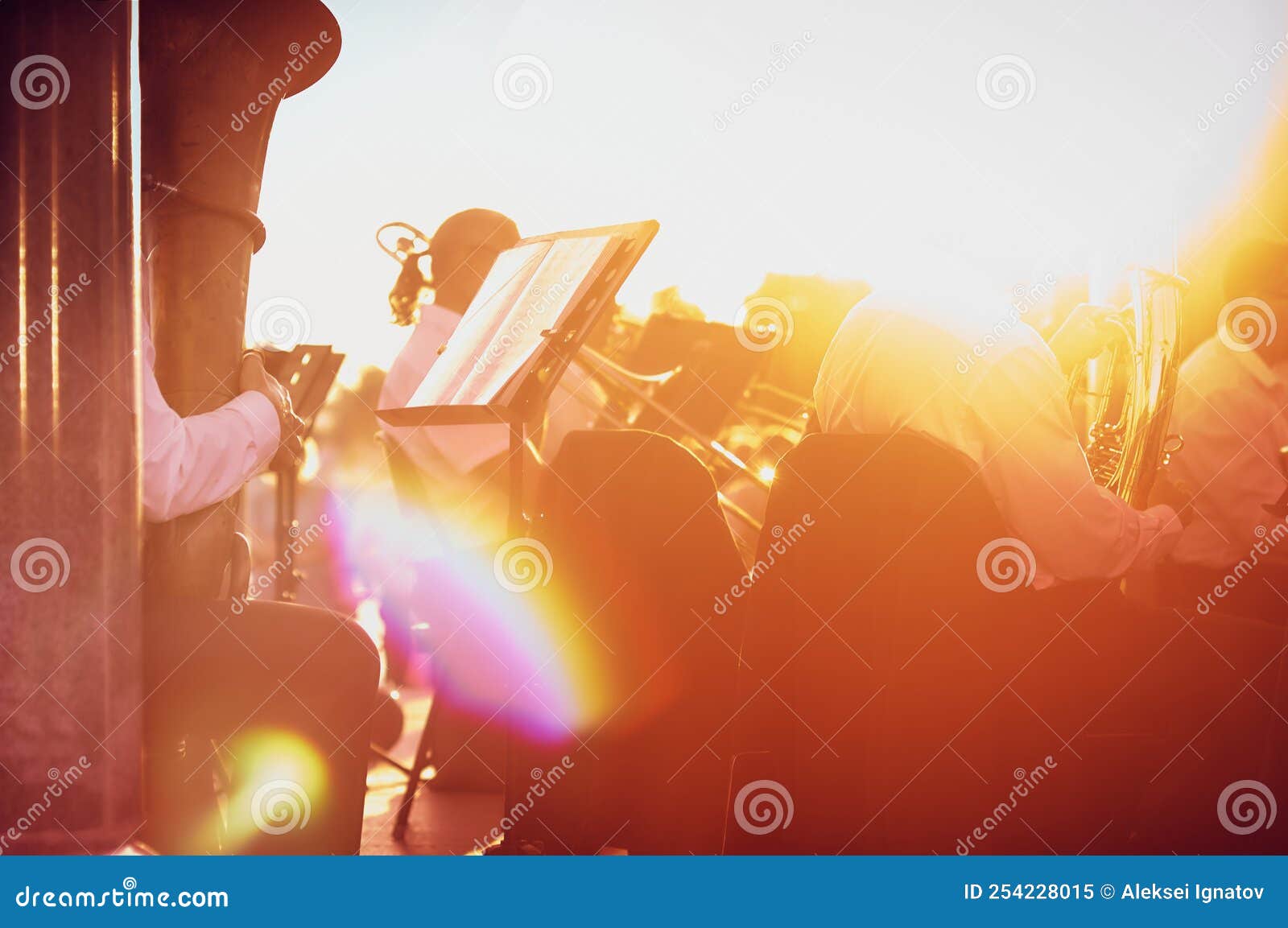 People Playing Wind Musical Instruments at Sunset, Creative Abstract ...