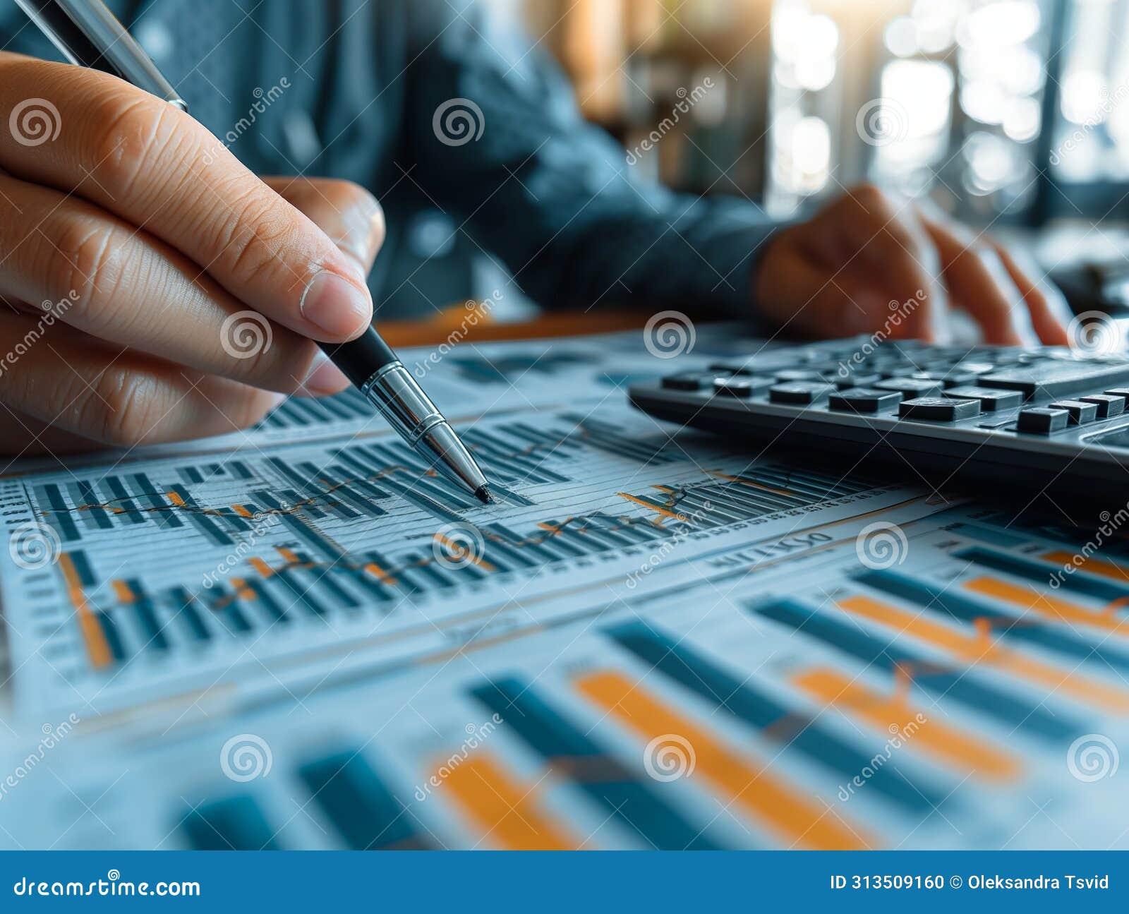 People Pointing Graph and Using Calculator during a Business Meeting ...