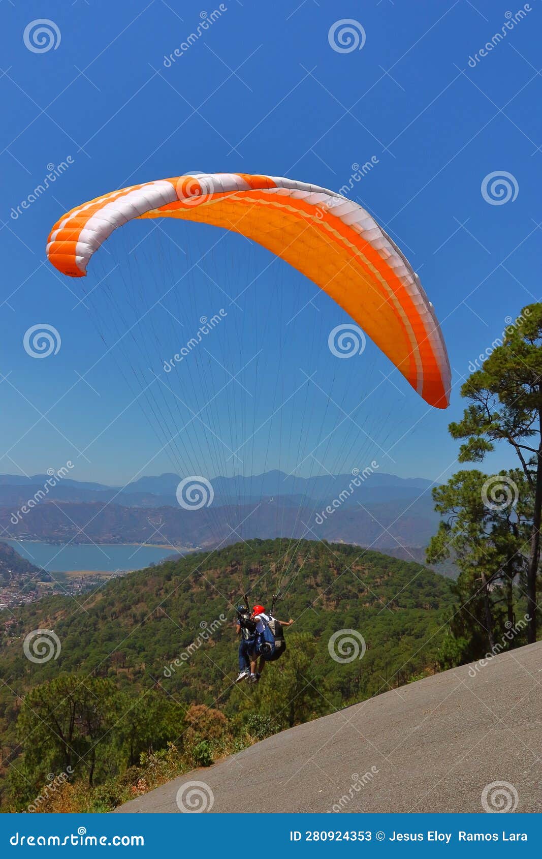 People Practicing Paragliding Over the Lake of Valle De Bravo, Mexico ...