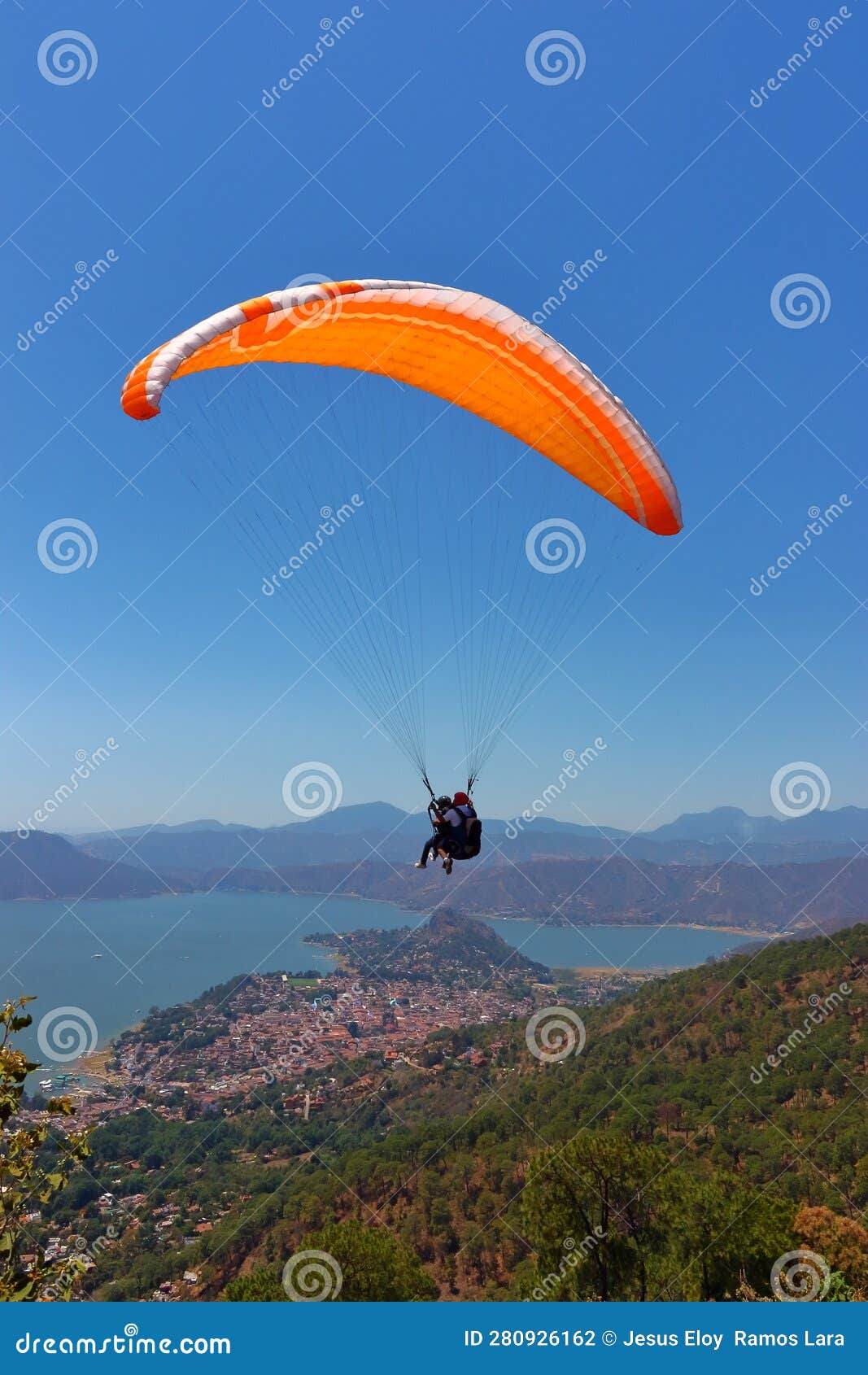 People Practicing Paragliding Over the Lake of Valle De Bravo, Mexico ...