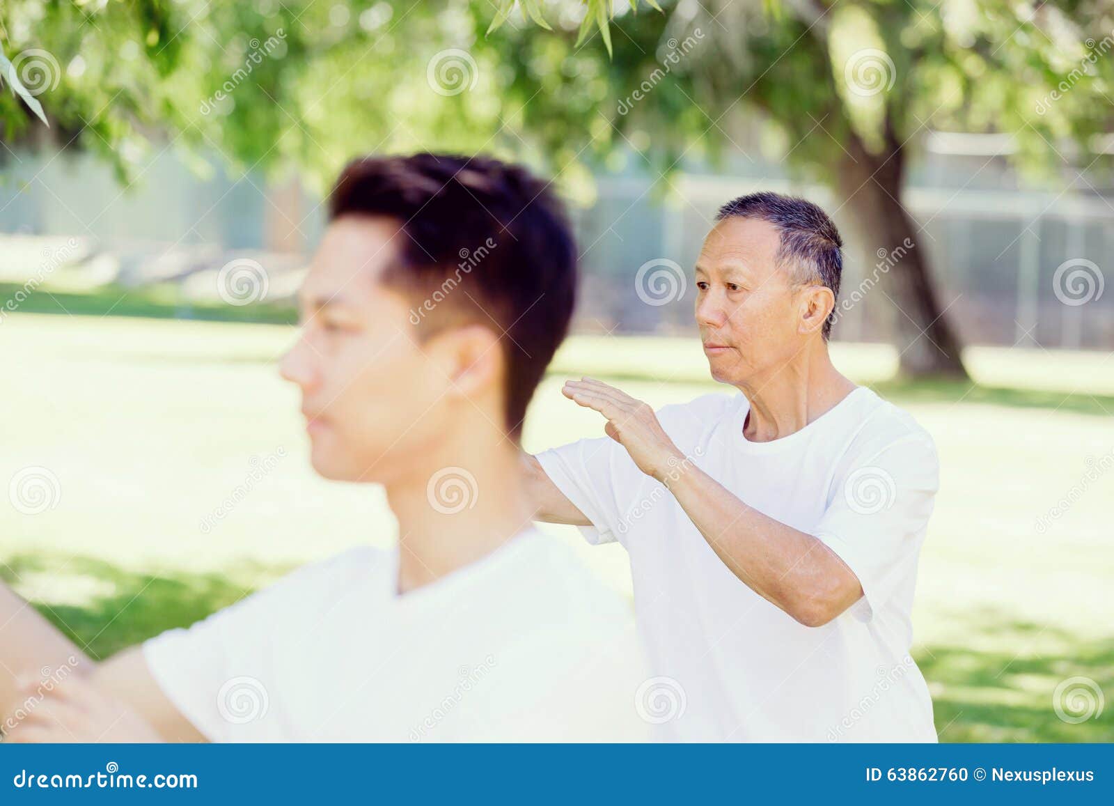 People Practicing Thai Chi in Park Stock Photo - Image of energy, asian ...