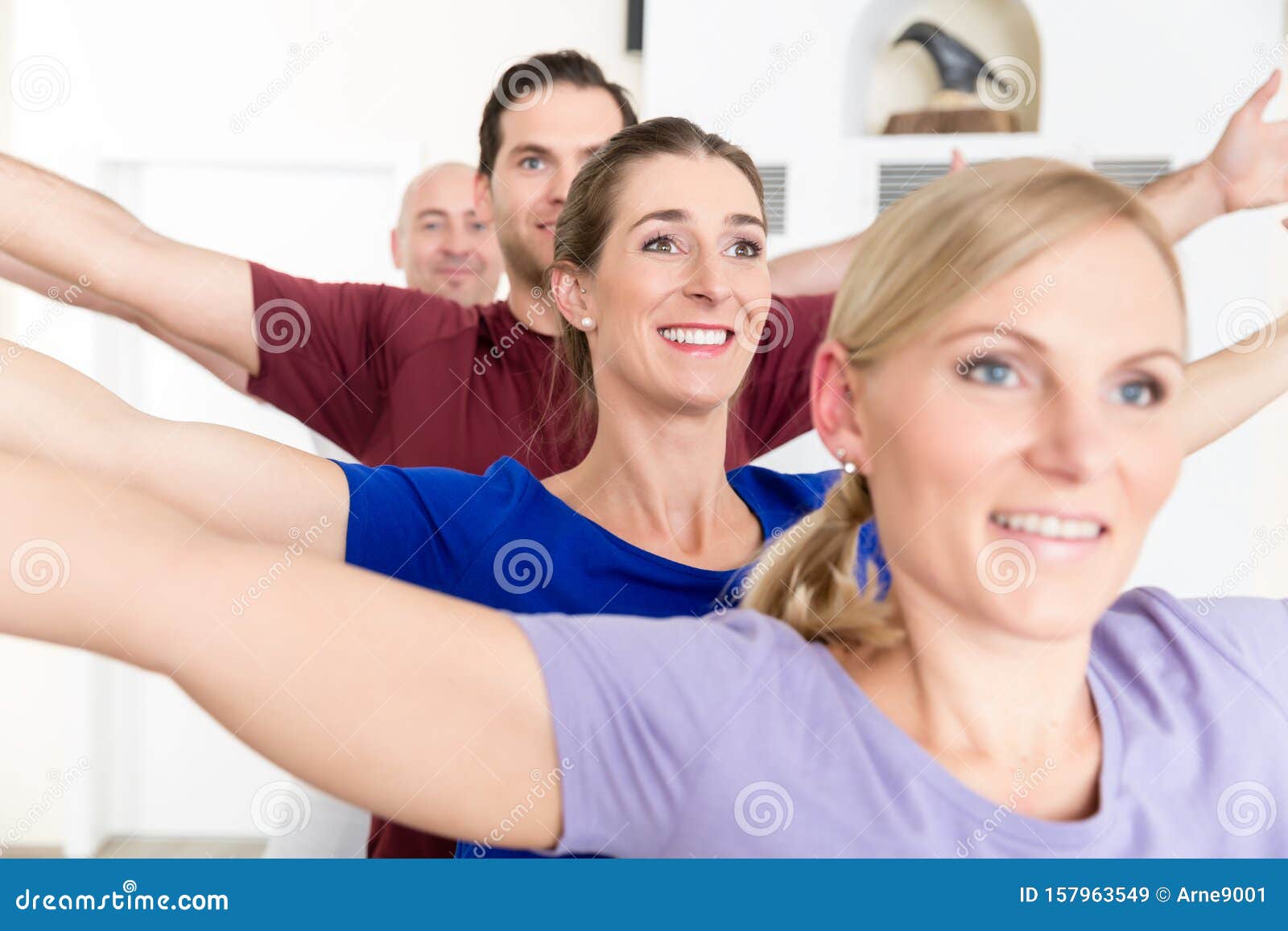 People Practicing Yoga Lesson Stock Image - Image of hand, healthy ...