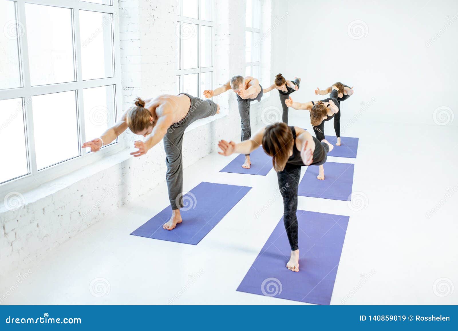 People Practising Yoga in the Studio Stock Image - Image of friends ...