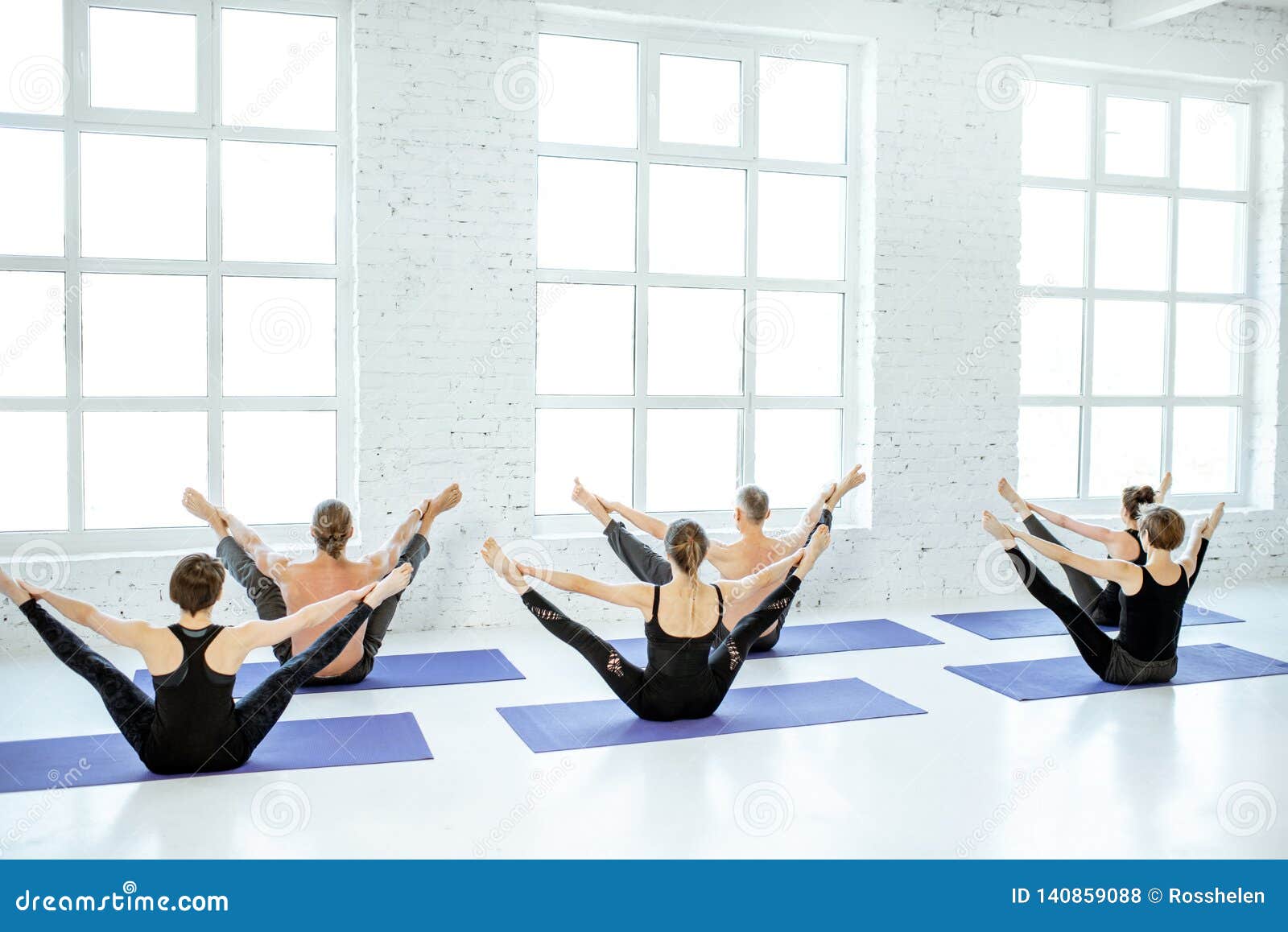 People Practising Yoga in the Studio Stock Photo - Image of hatha ...