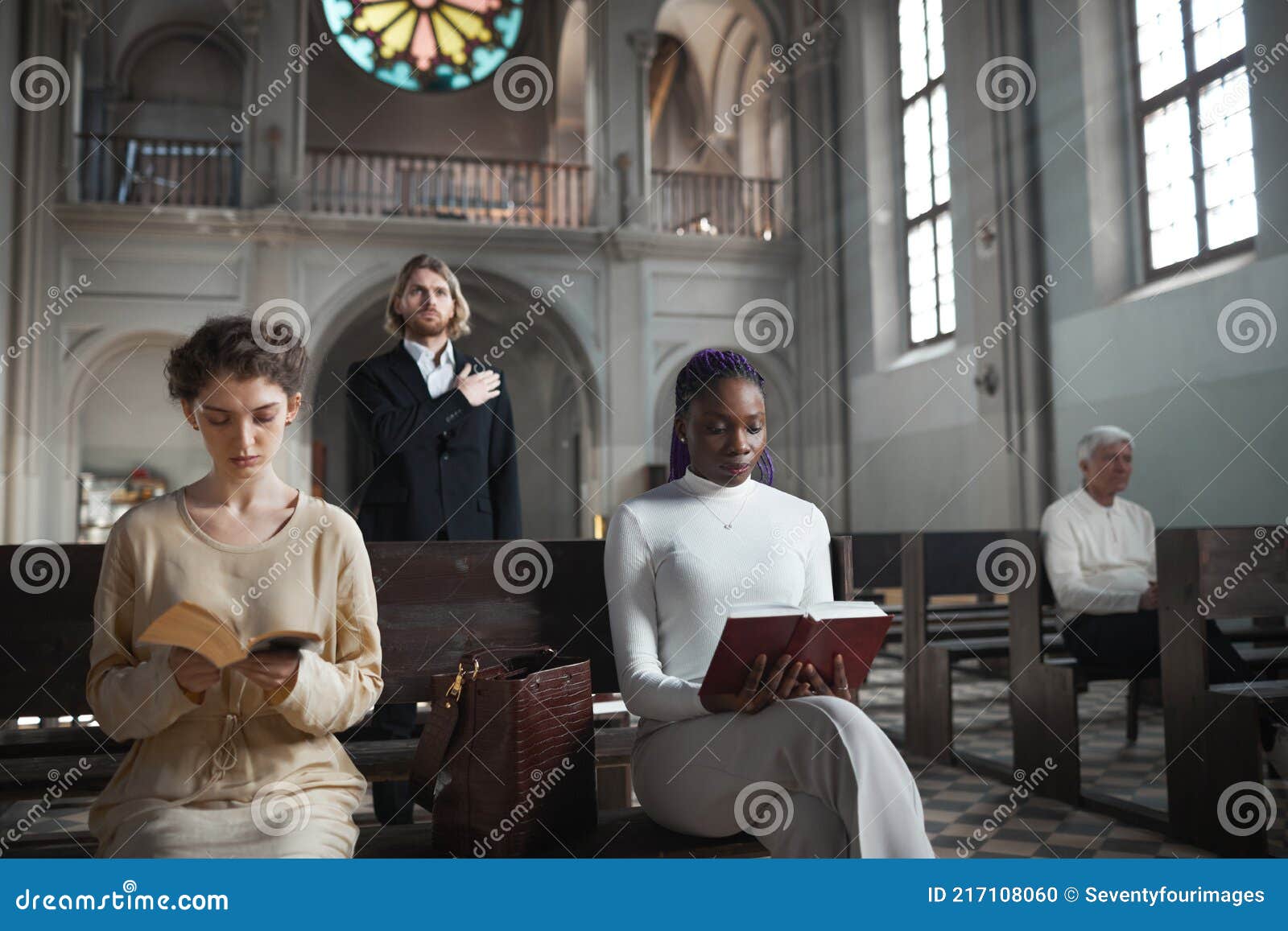 People praying during mass stock photo. Image of praying - 217108060