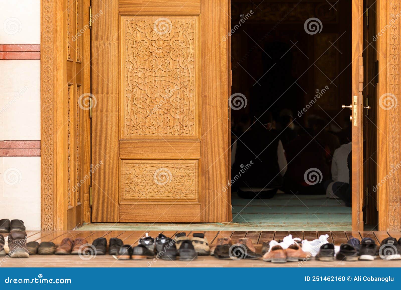 People Praying in a Mosque. Shoes in Front of the Mosque Stock Photo ...