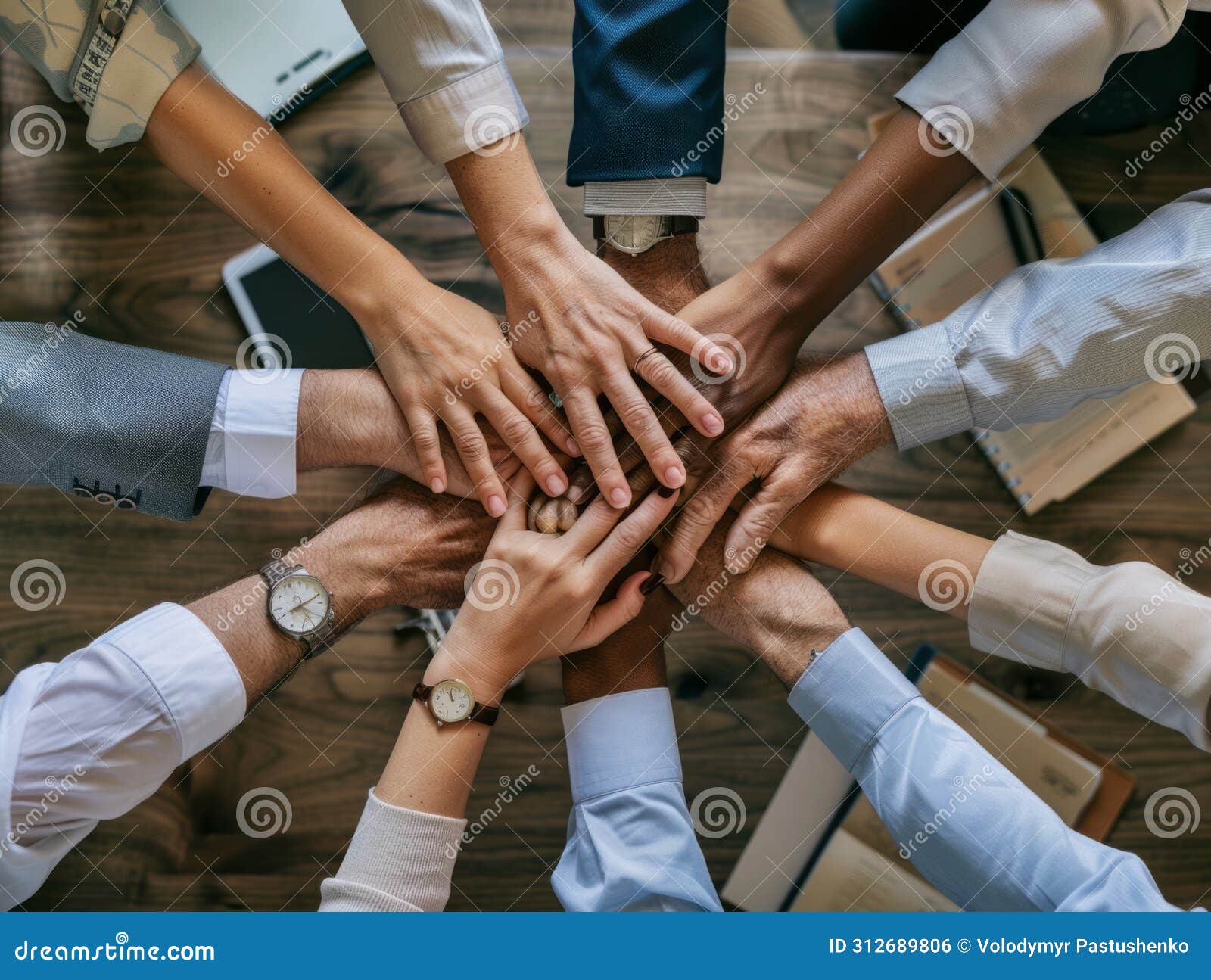 People Putting Their Hands in the Middle Stock Photo - Image of ...