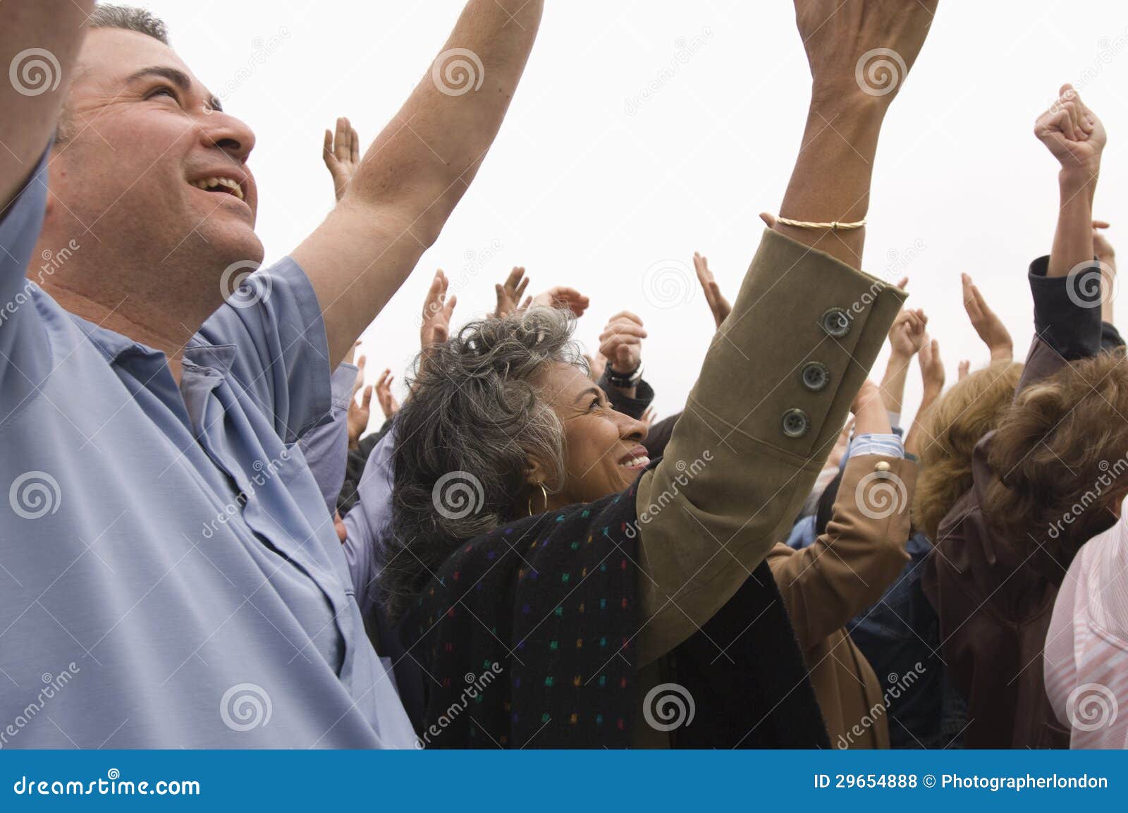 People with Raised Hands in Rally Stock Photo - Image of looking ...