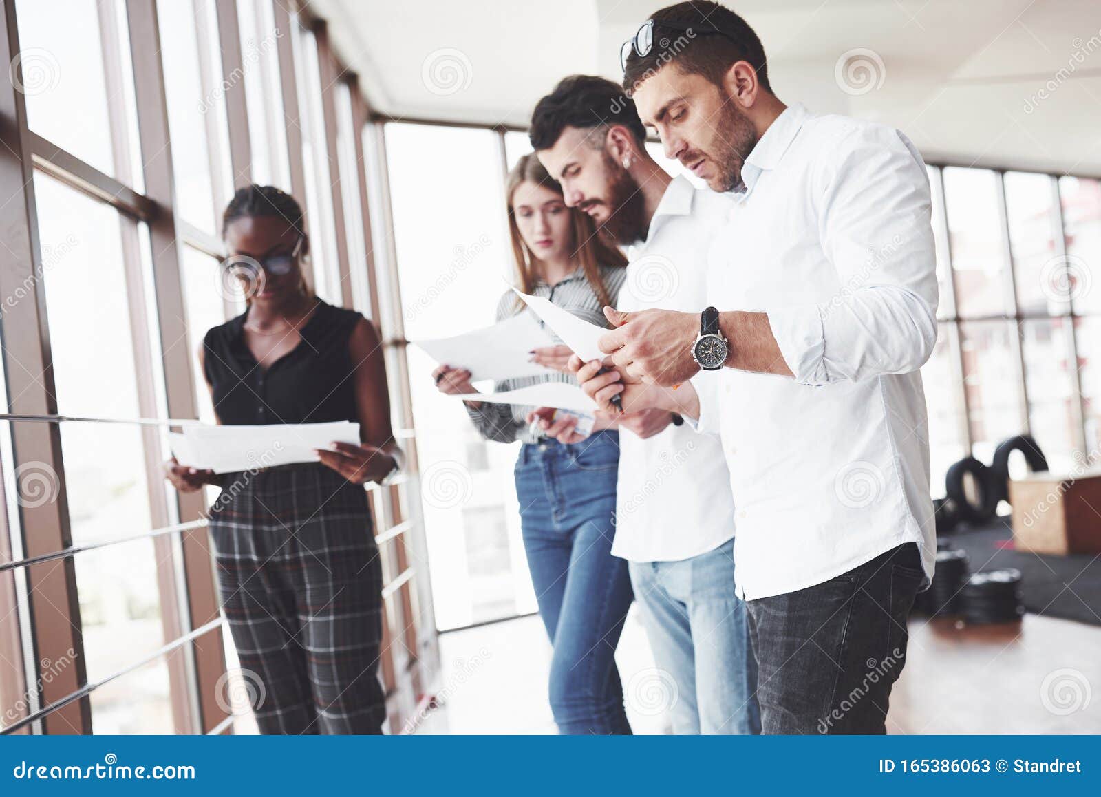People Reading Documents in the Office with Big Windows Stock Image ...