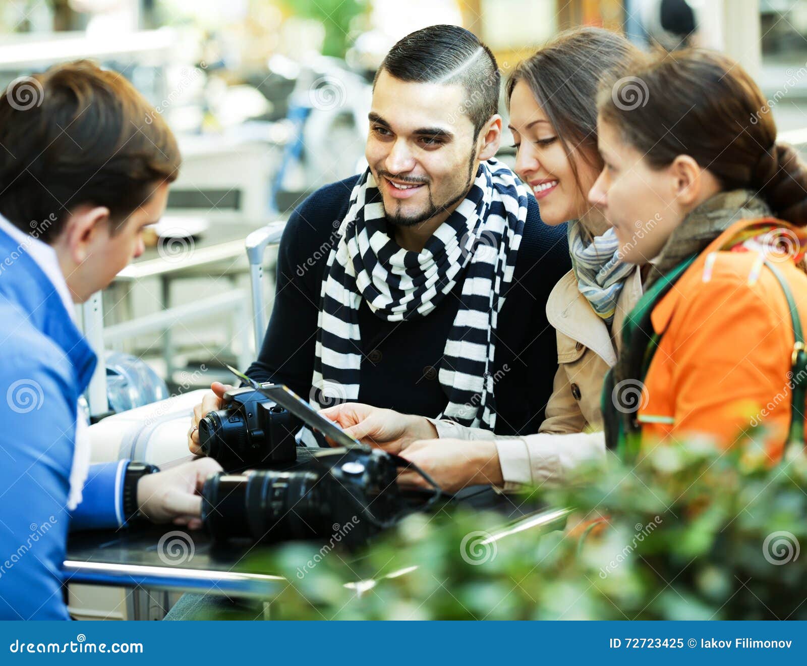People reading map at cafe stock image. Image of looking - 72723425