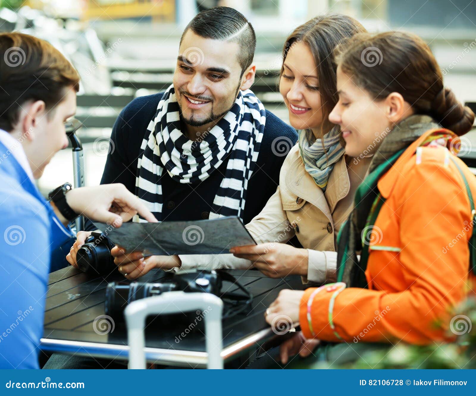 People reading map at cafe stock photo. Image of friendship - 82106728