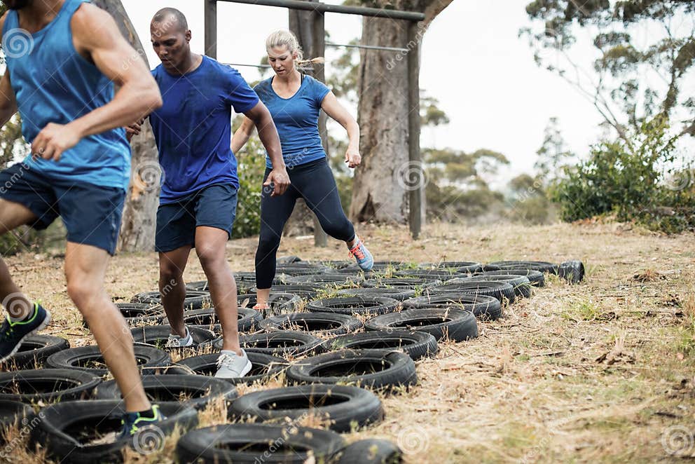 People Receiving Tire Obstacle Course Training Stock Image - Image of ...