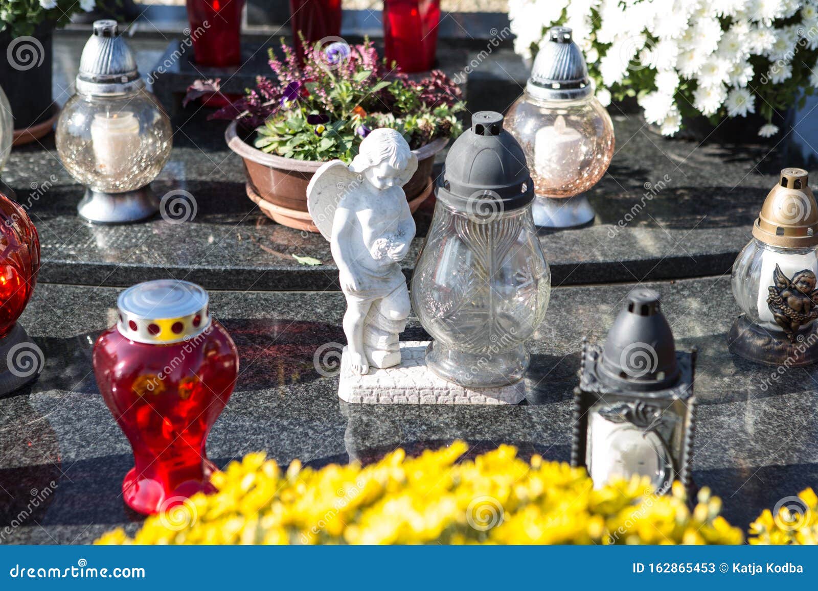 People Remembering Their Loved Ones Who Died; on the Cemetery Stock ...