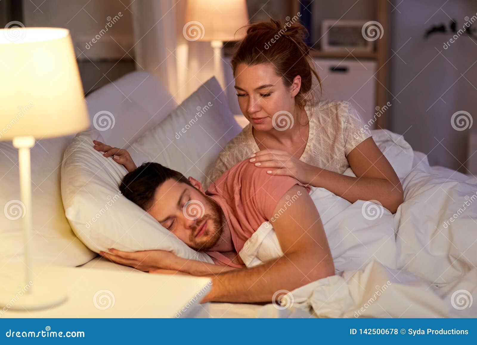 Woman Wakes Her Sleeping Husband Up in Bed at Home Stock Photo - Image ... Woman Wakes Her Sleeping Husband Up in Bed at Home Stock Photo - Image ...
